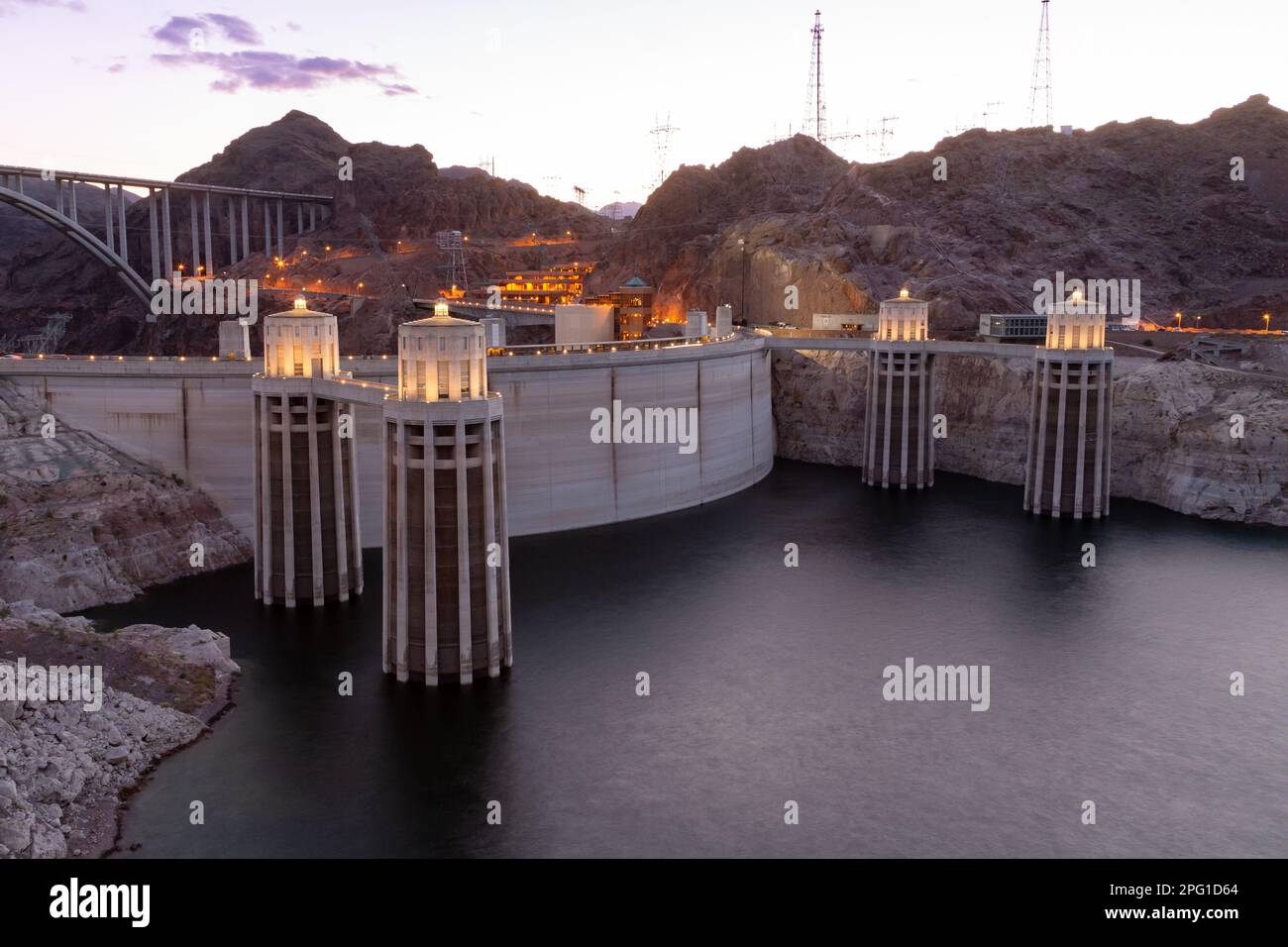 Hoover Dam at sunset in the evening with illuminations without people ...