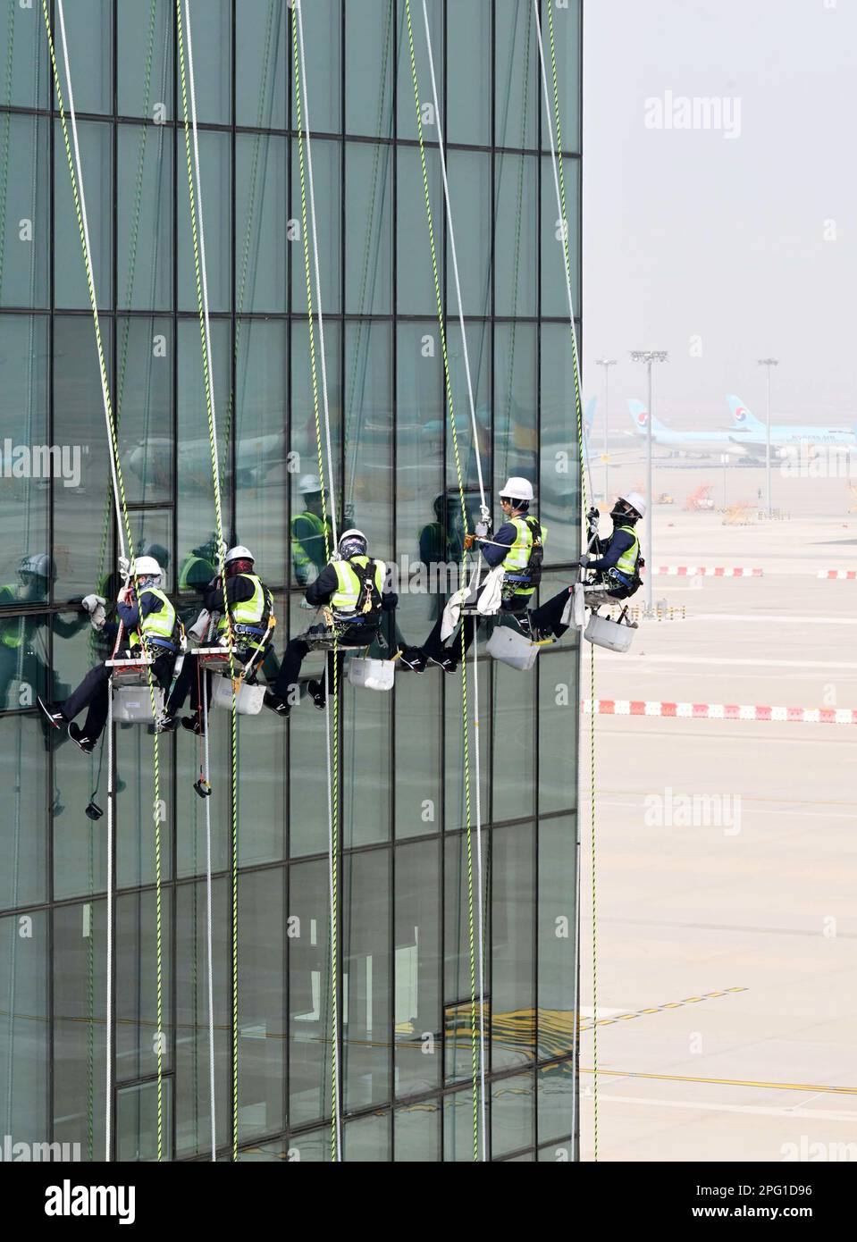 20th Mar, 2023. Spring cleaning at Incheon Airport Workers hanging from ...