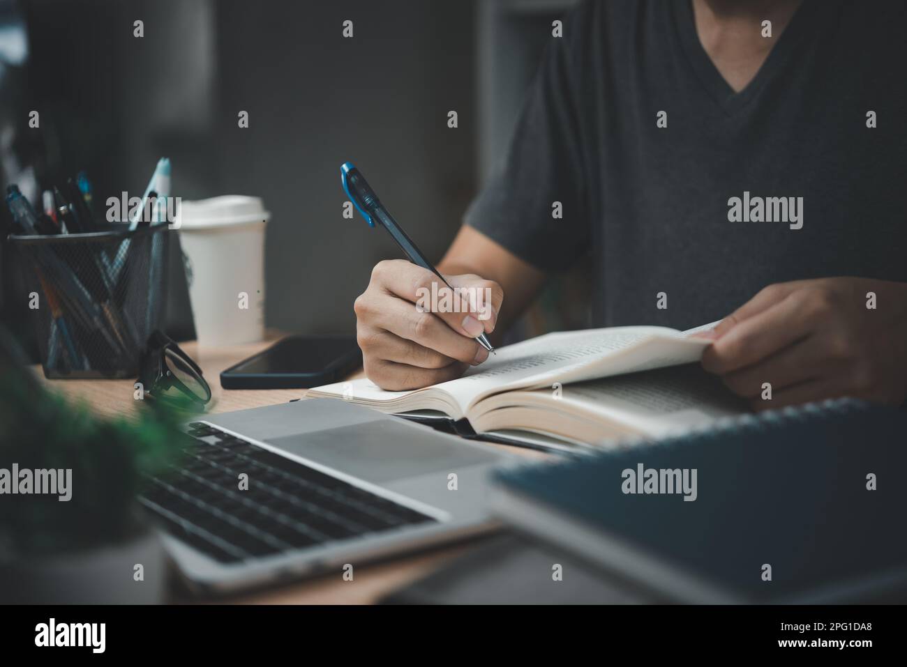 man hands with pen writing on notebook in the office.learning ...