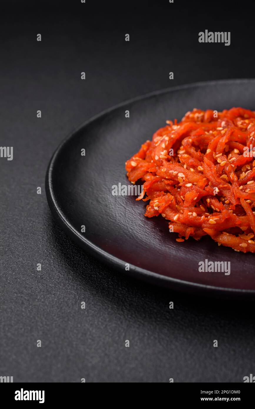 Dried squid chopped into slices and seasoned with sesame seeds and ...