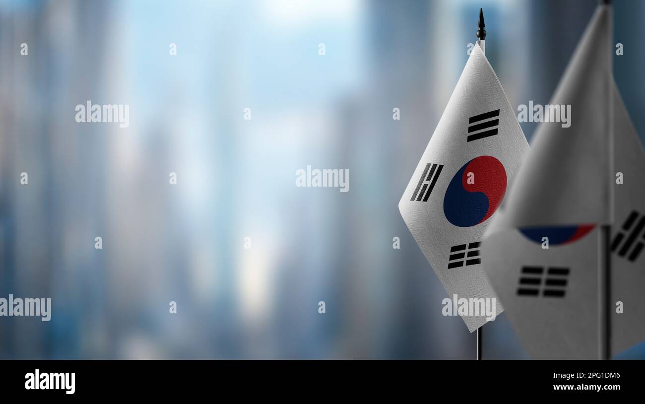 Small flags of the South Korean on an abstract blurry background Stock ...