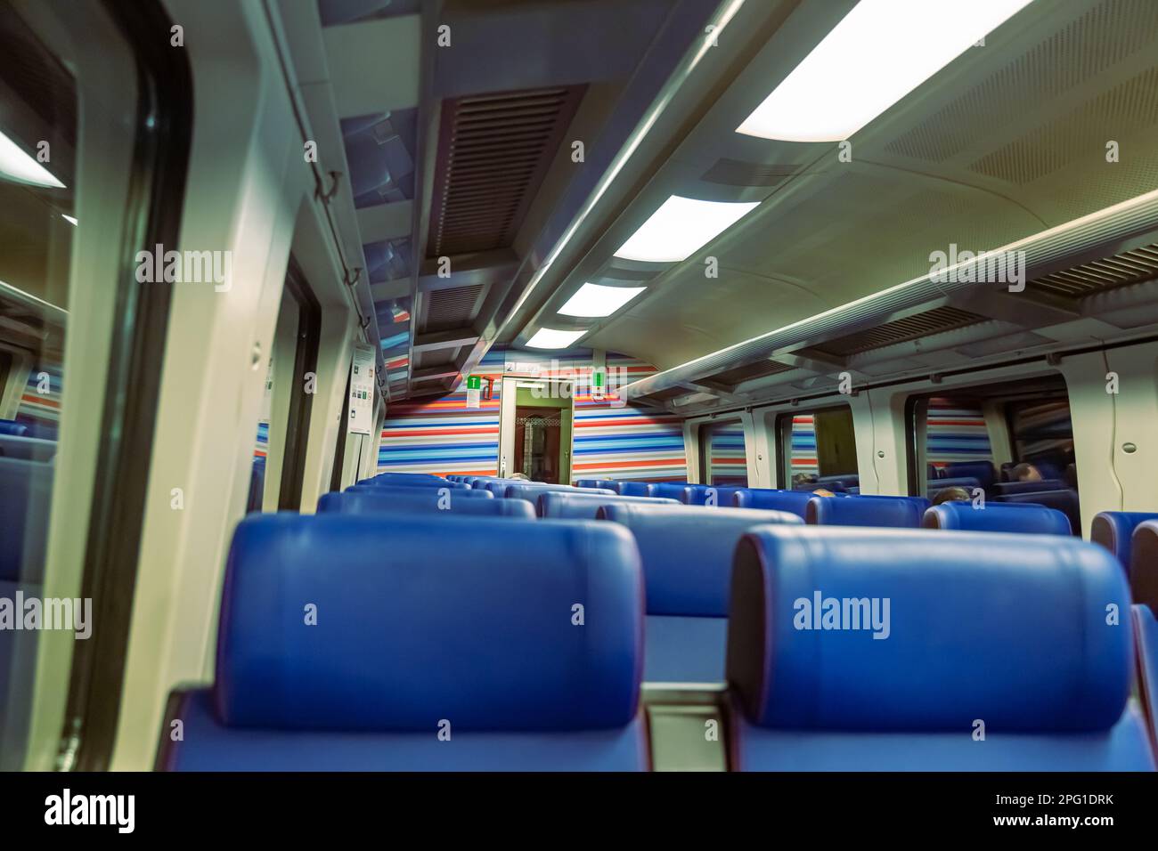 Seats in a suburban train. Passenger Empty wagon with Blue Seats ...