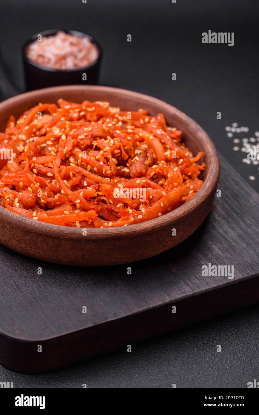 Dried squid chopped into slices and seasoned with sesame seeds and ...