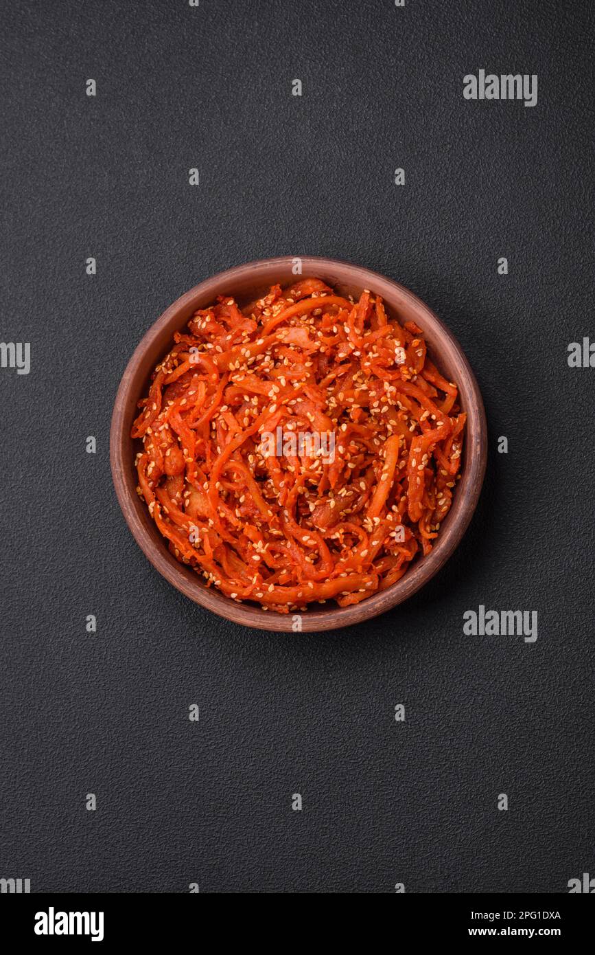 Dried squid chopped into slices and seasoned with sesame seeds and ...