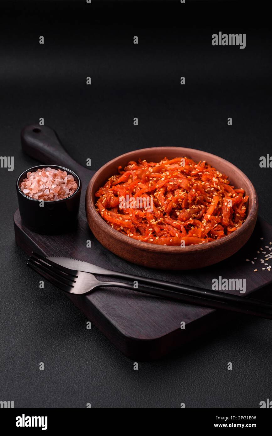 Dried squid chopped into slices and seasoned with sesame seeds and ...