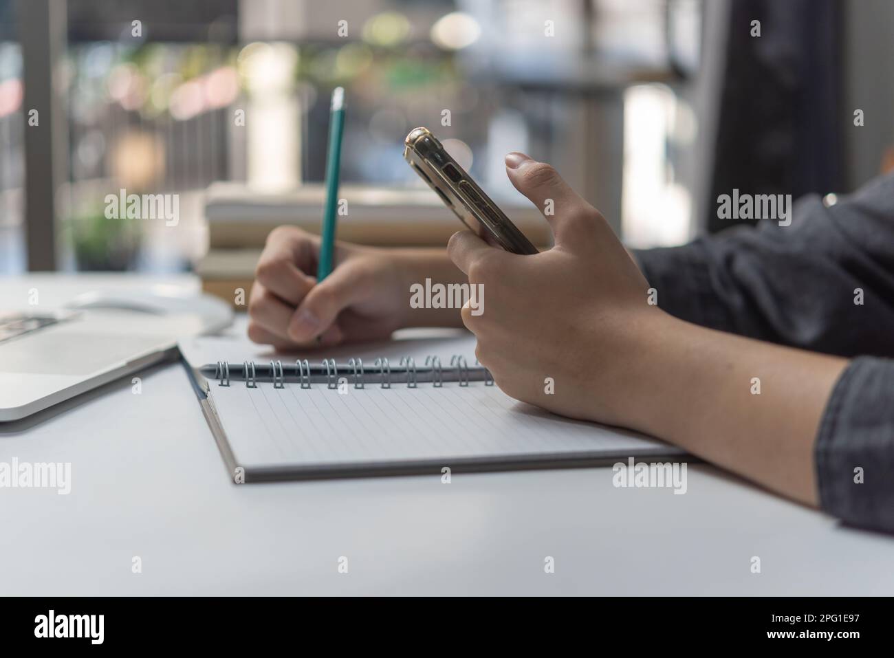 Woman hands with pen writing on notebook in the office.learning ...