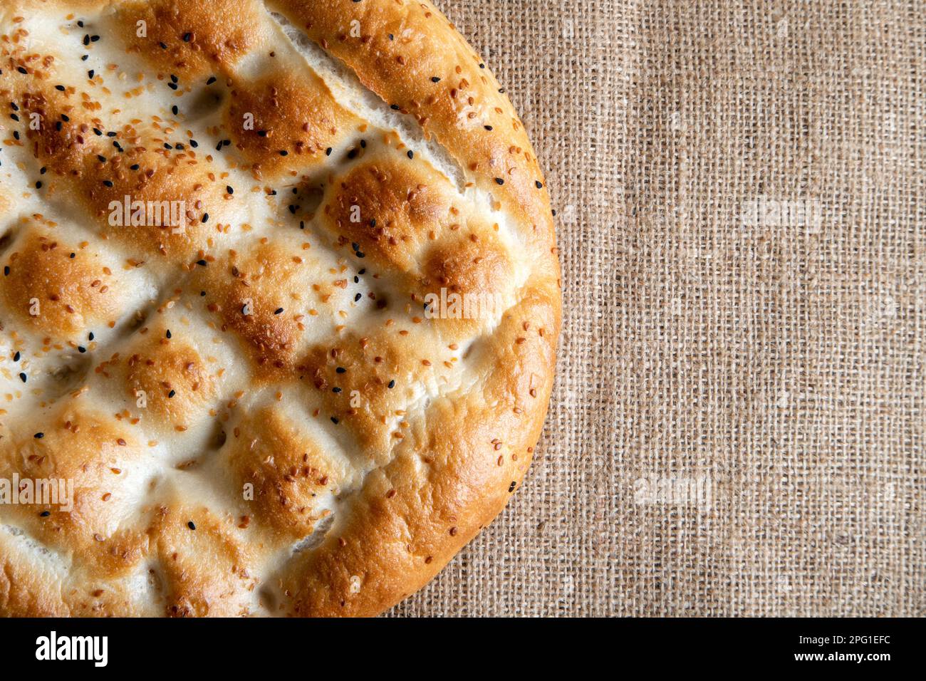 Traditional Ramadan pita on burlap sack.Holy bread for Muslims Stock ...