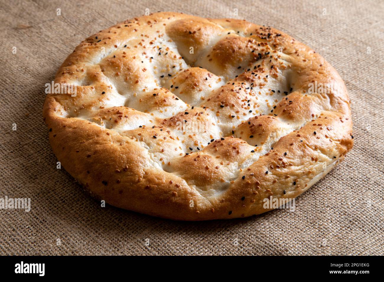 Traditional Ramadan pita on burlap sack.Holy bread for Muslims Stock ...