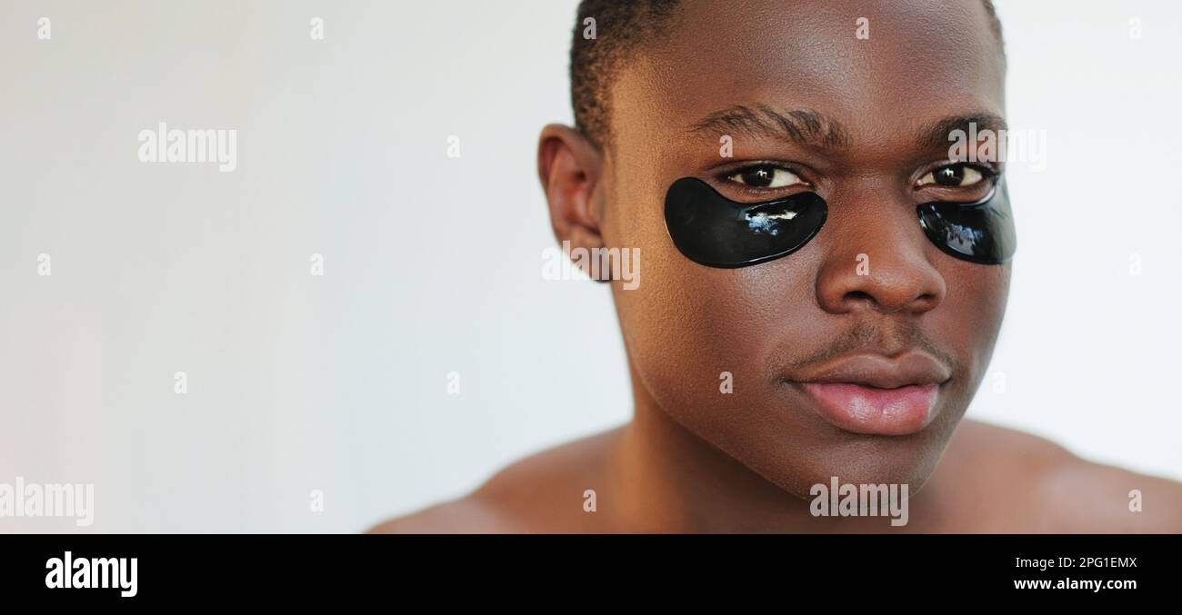 Collagen patches skin treatment man face under eye Stock Photo - Alamy