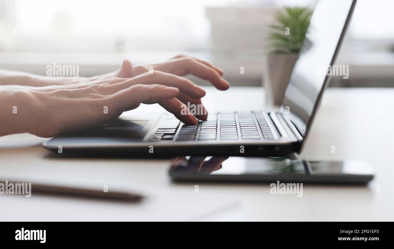 Online work digital business hands typing laptop Stock Photo - Alamy