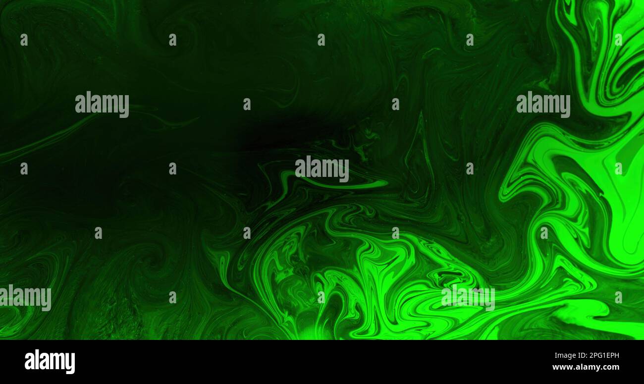 Fluid mix ink water neon green black paint Stock Photo - Alamy