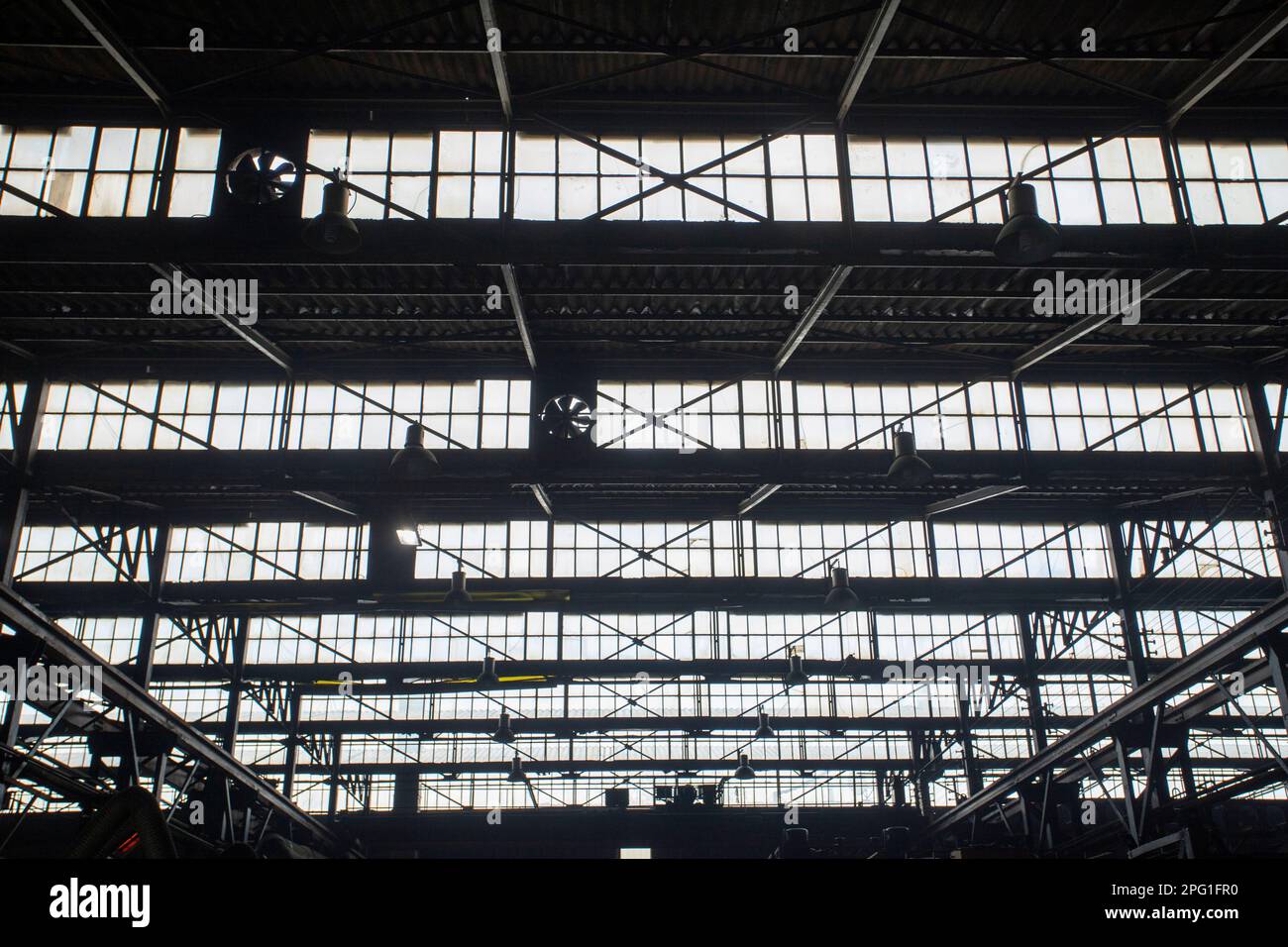 Factory windows opened sequentially. Factory background Stock Photo - Alamy