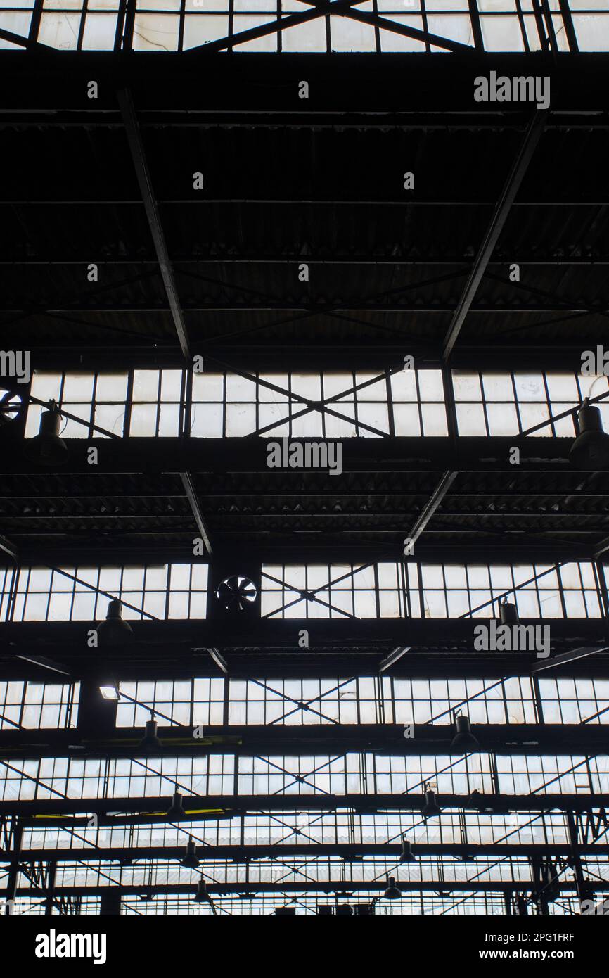 Factory windows opened sequentially. Factory background Stock Photo - Alamy