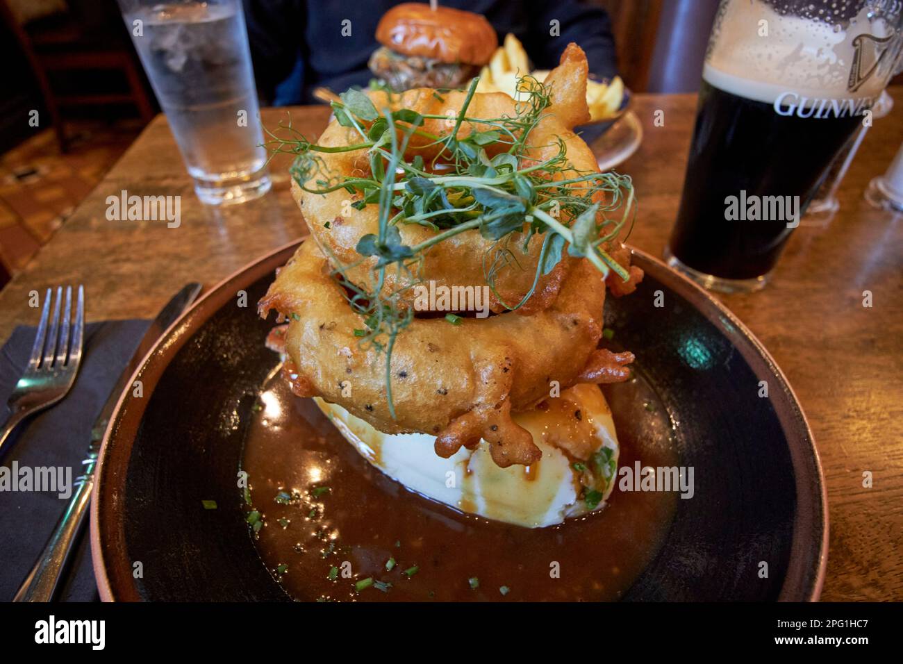 chicken stack lunch meal with pint of guinness at the kitchen bar ...