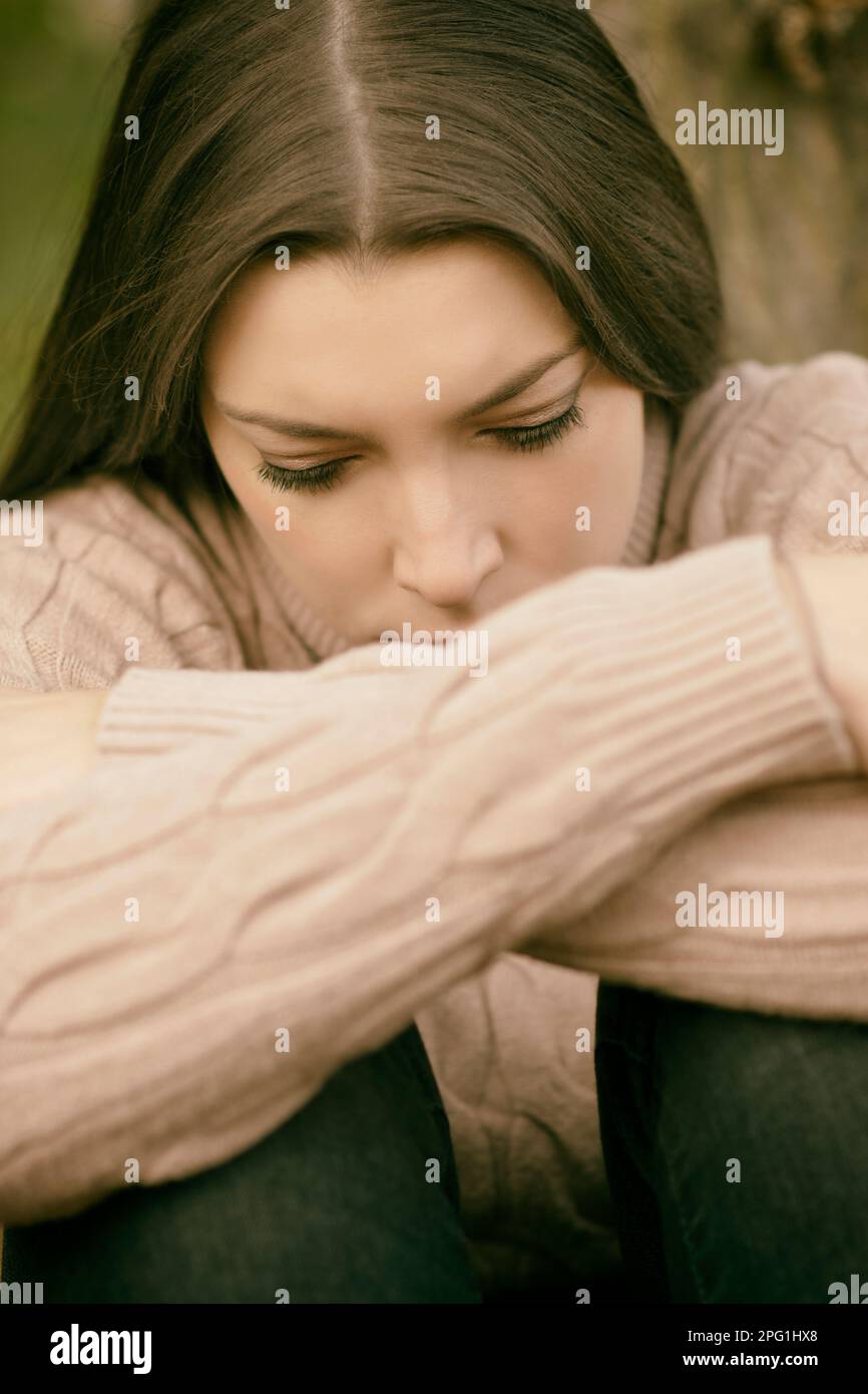 Sad beautiful woman outdoors Stock Photo - Alamy