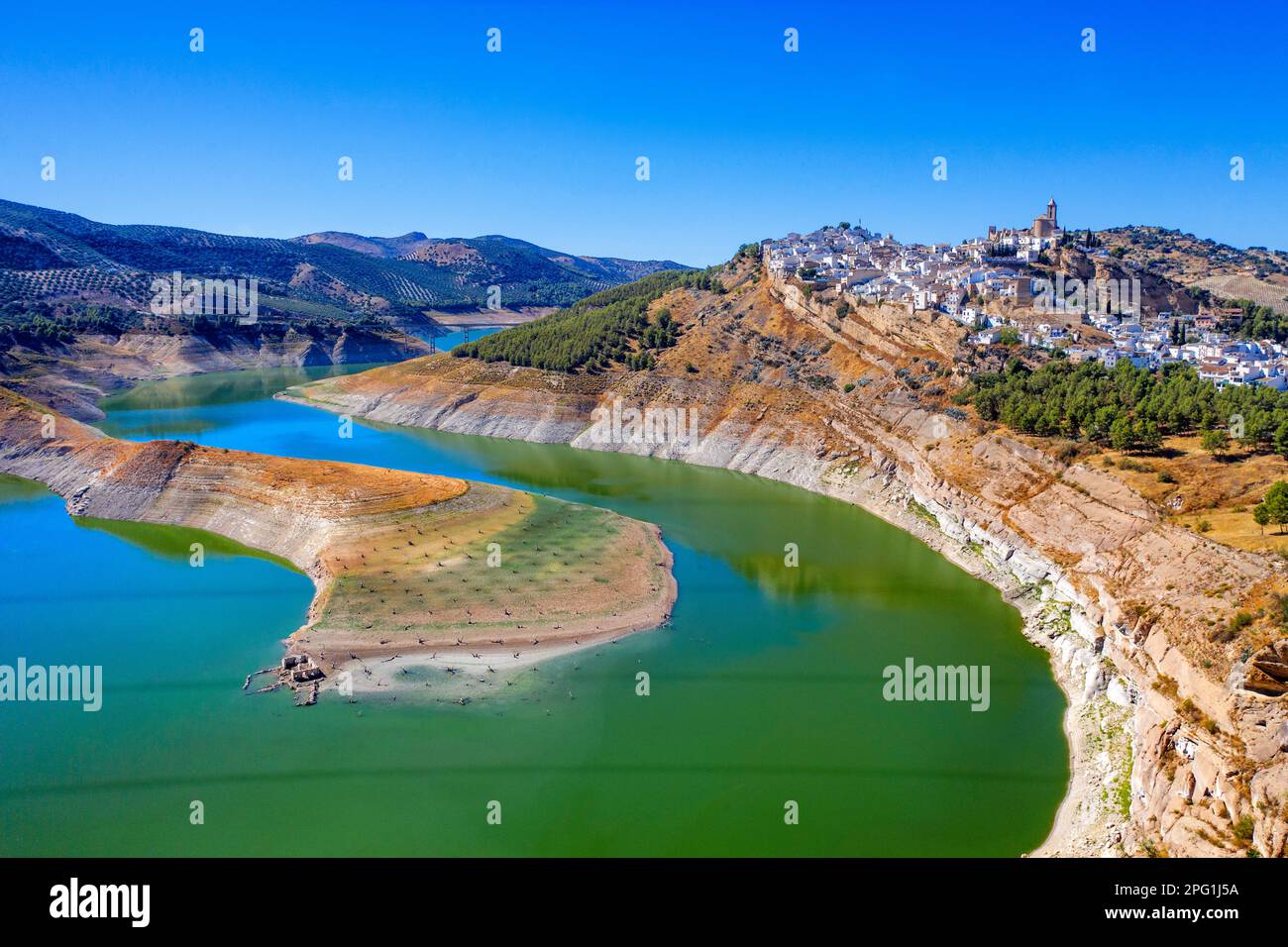 Aerial view of Iznajar village and lake reservoir in Cordoba province ...