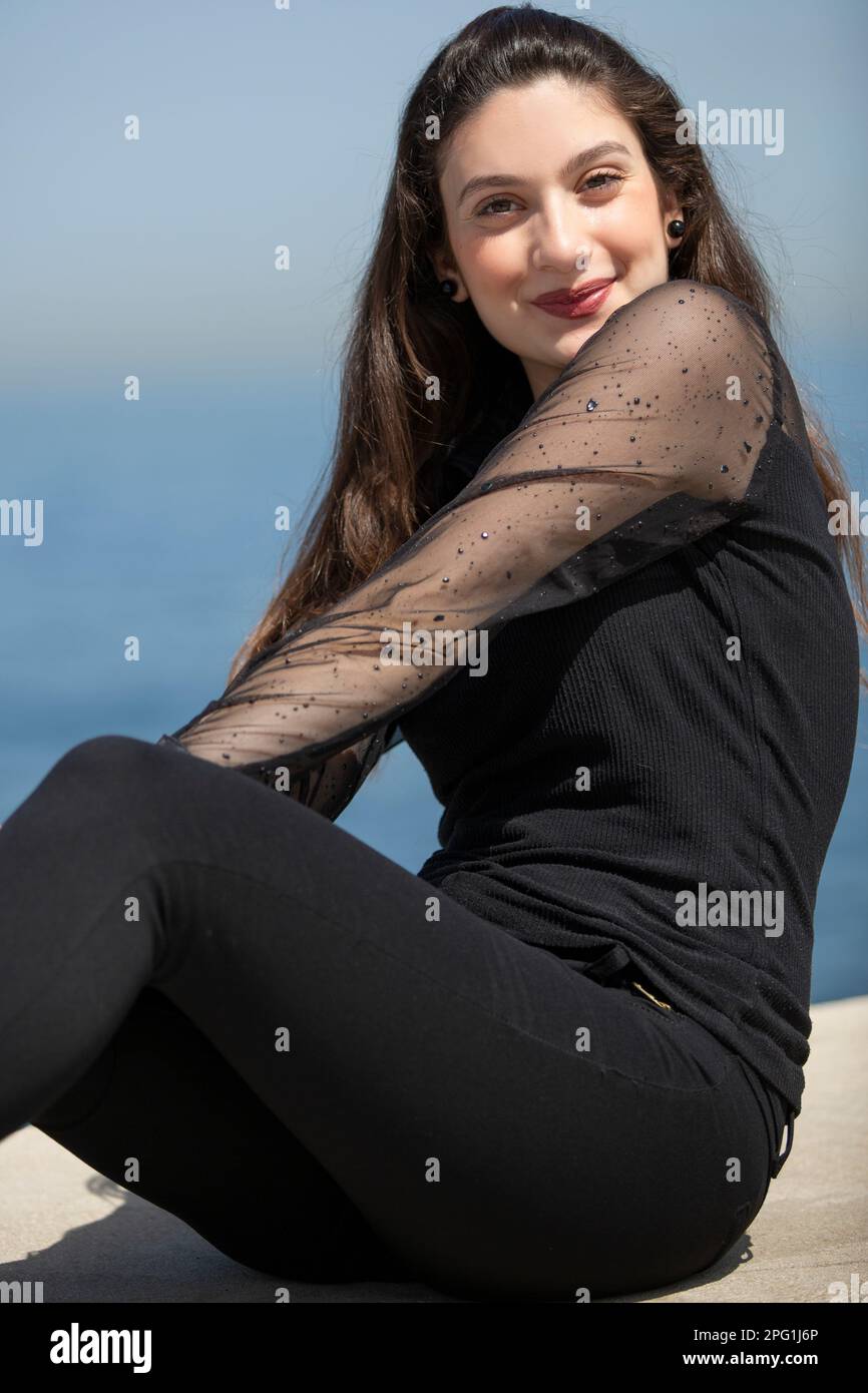 Beautiful woman smiling outdoors Stock Photo - Alamy