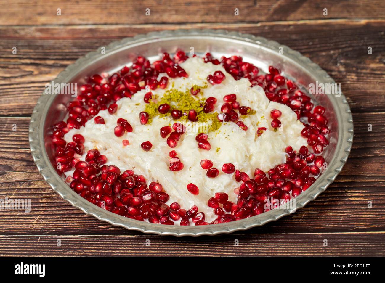 Gullac dessert. Ramadan dessert. Gullac decorated with pomegranate and ...
