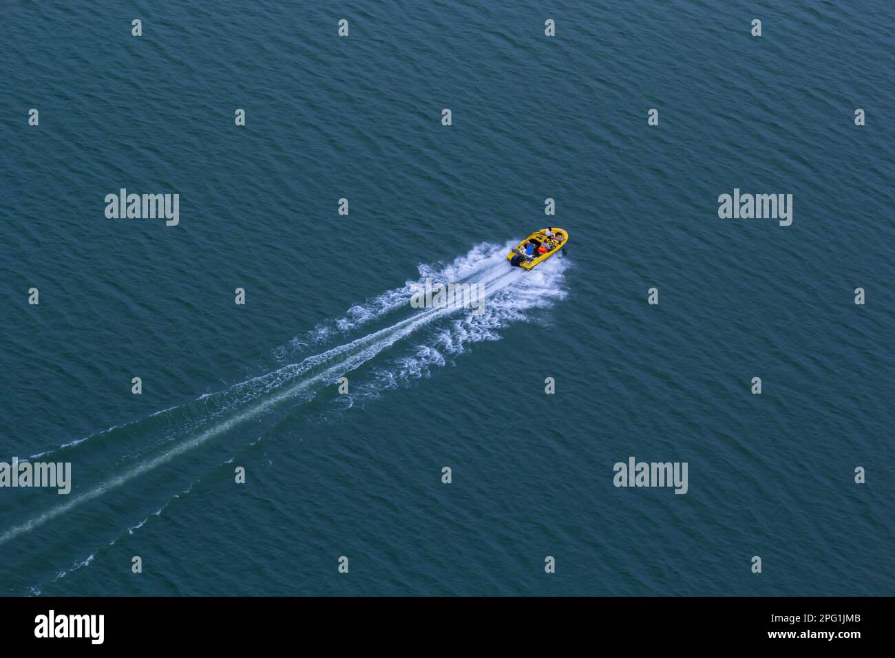 A top-down view of the speed of a motorboat sailing on water Stock ...