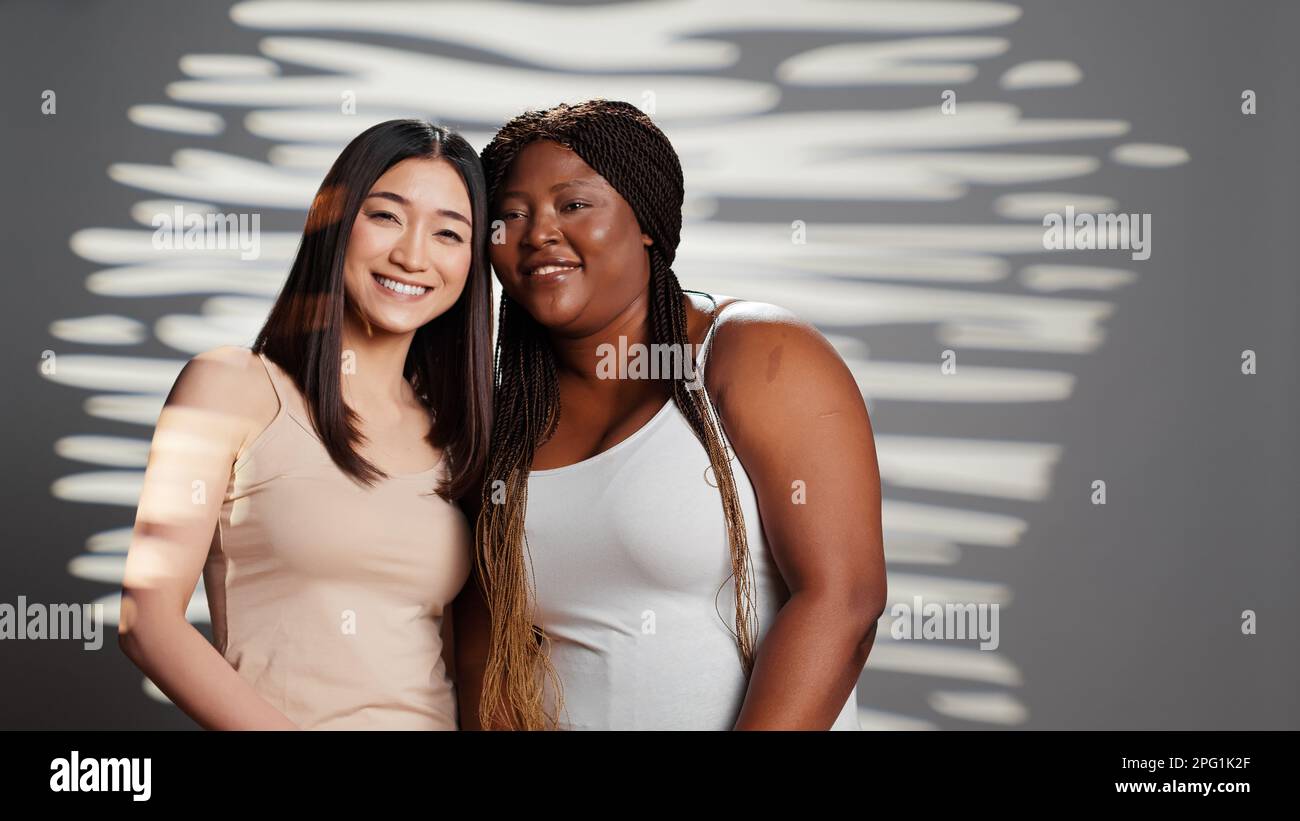 Diverse beauty models creating skincare ad on camera, promoting ...