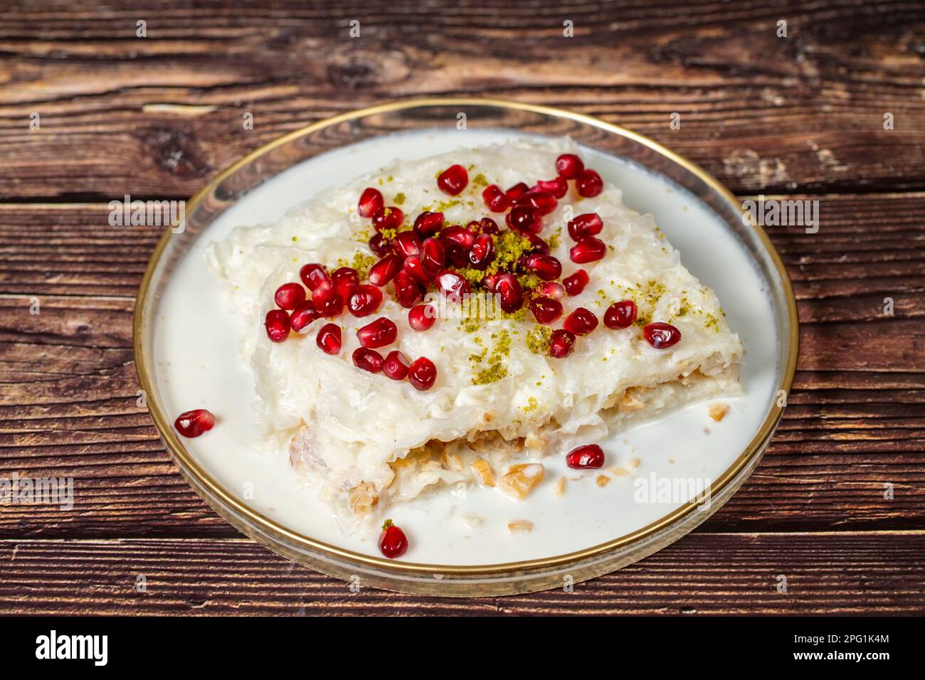 Gullac dessert. Ramadan dessert. Gullac garnished with pomegranate and ...