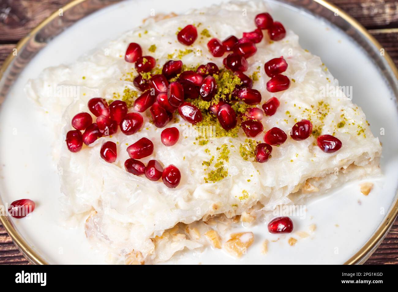 Gullac dessert. Ramadan dessert. Gullac garnished with pomegranate and ...