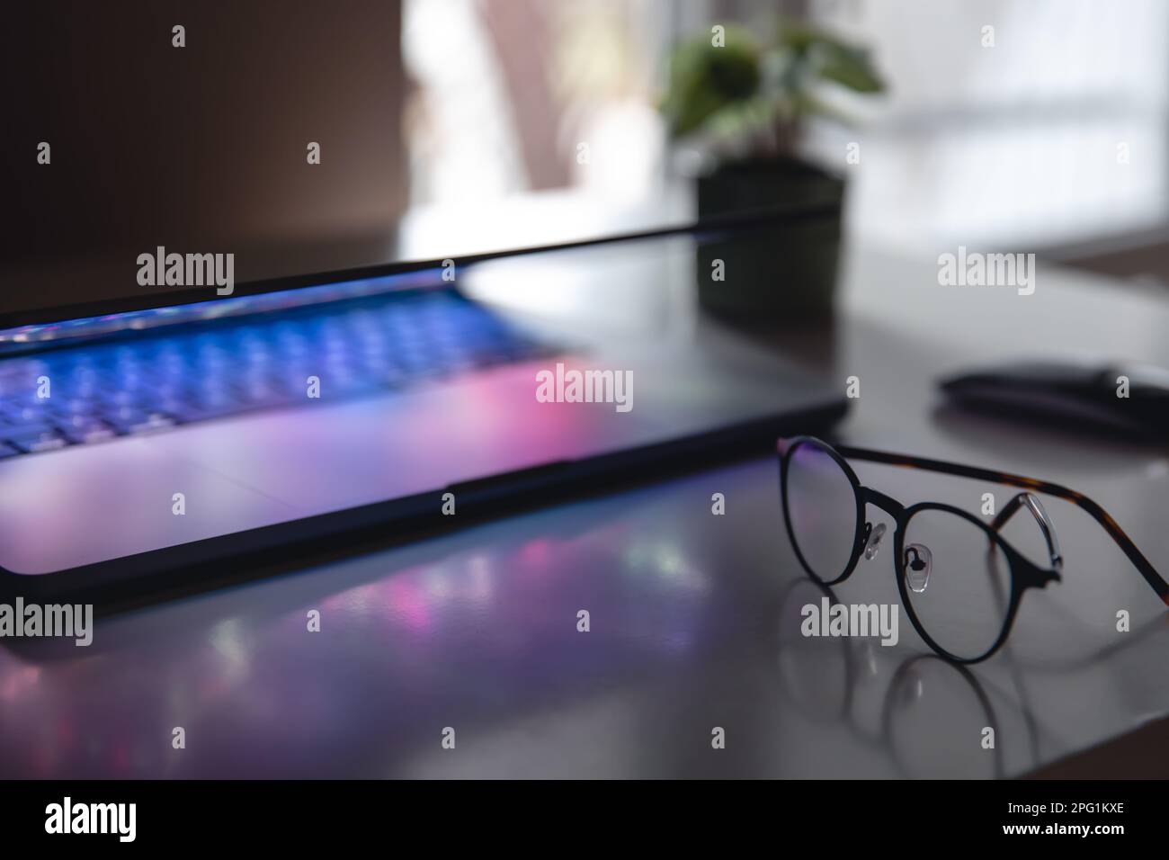 Close up of laptop keyboard colorful neon illumination, backlit ...