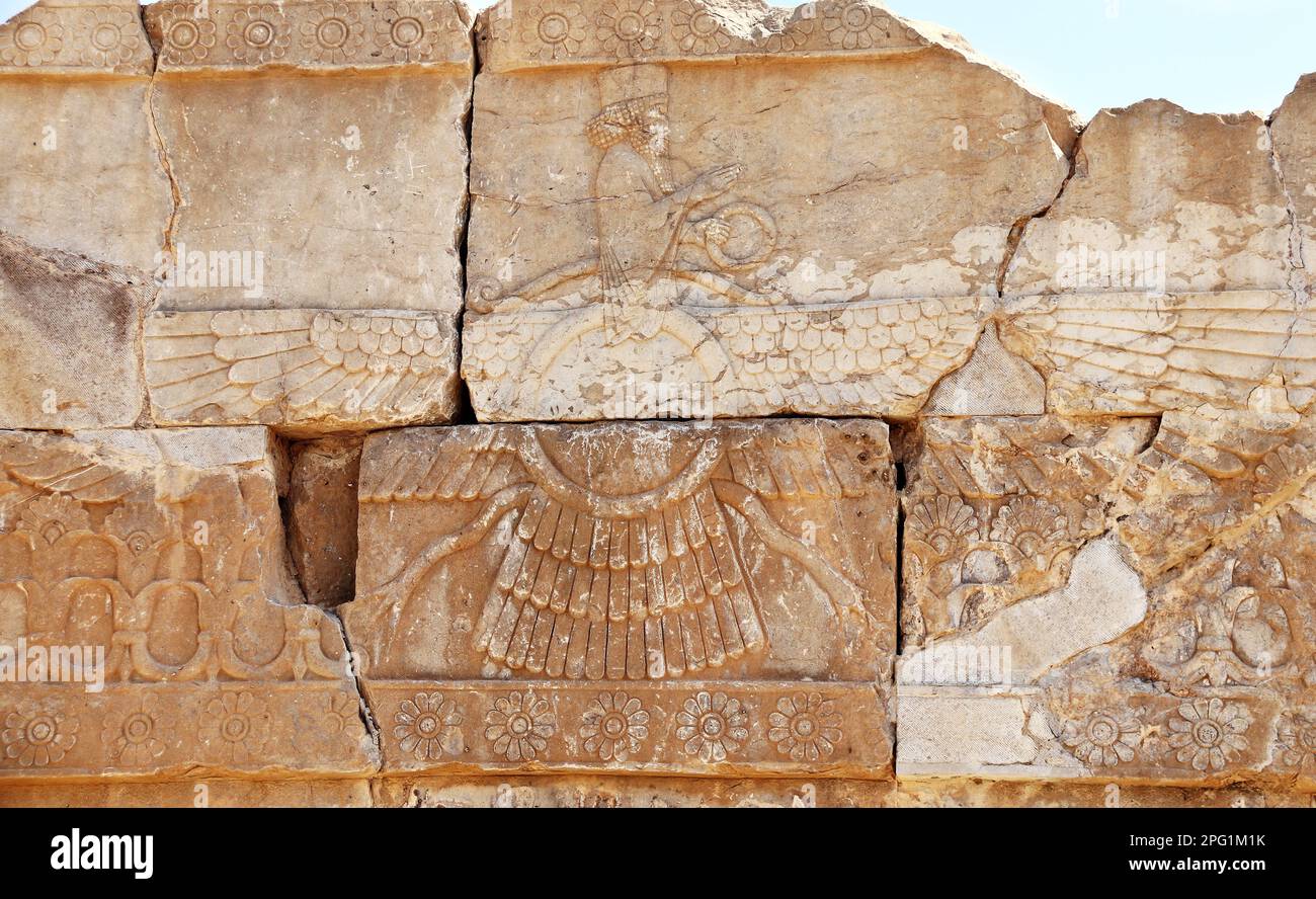 Ancient wall with bas-relief of Zoroastrian god Faravahar (Frahvahar ...