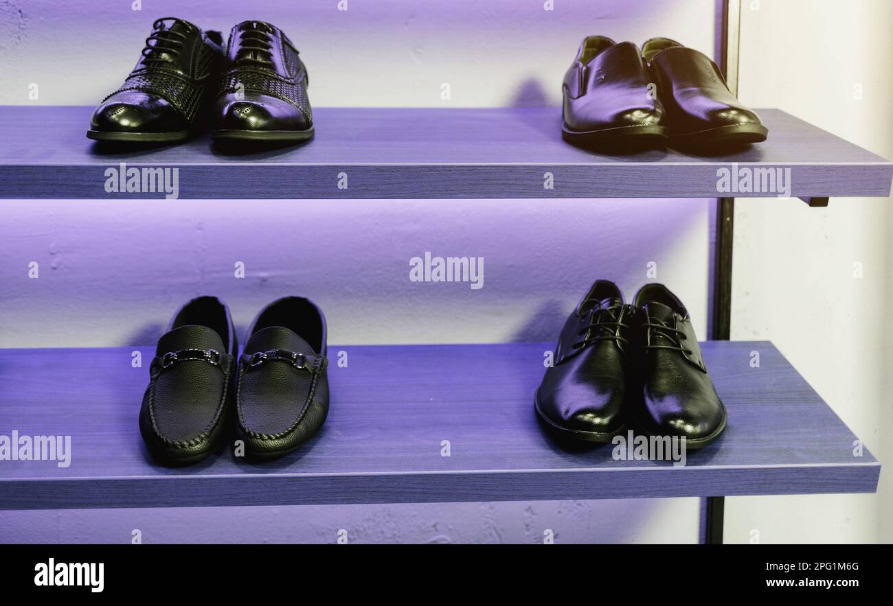 Men shoes in a store. high quality. men's wardrobe Stock Photo - Alamy