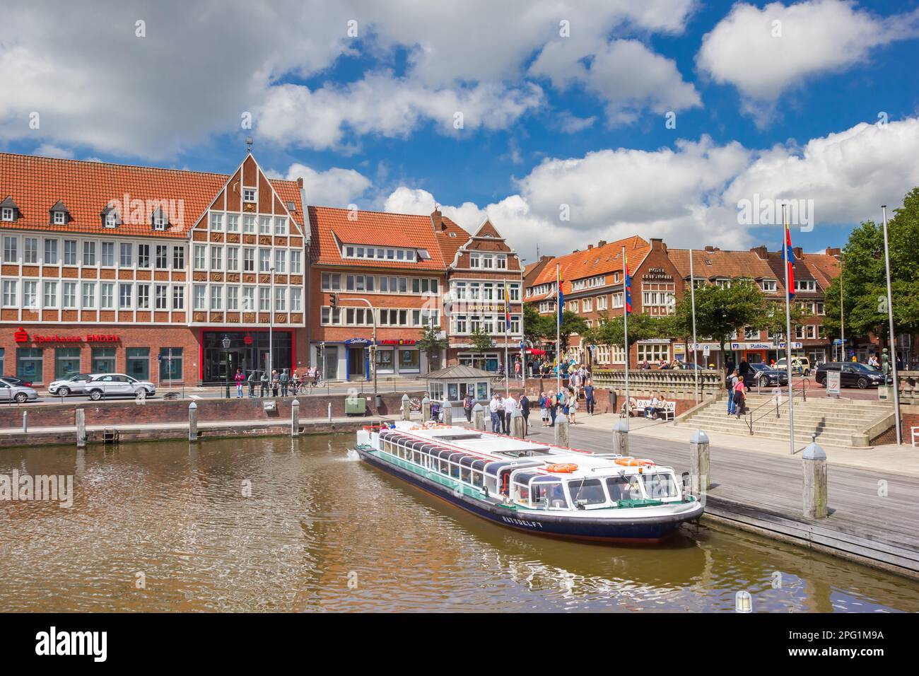 Tourists getting into a cruiseboat in the Ratsdelft harbor of Emden ...