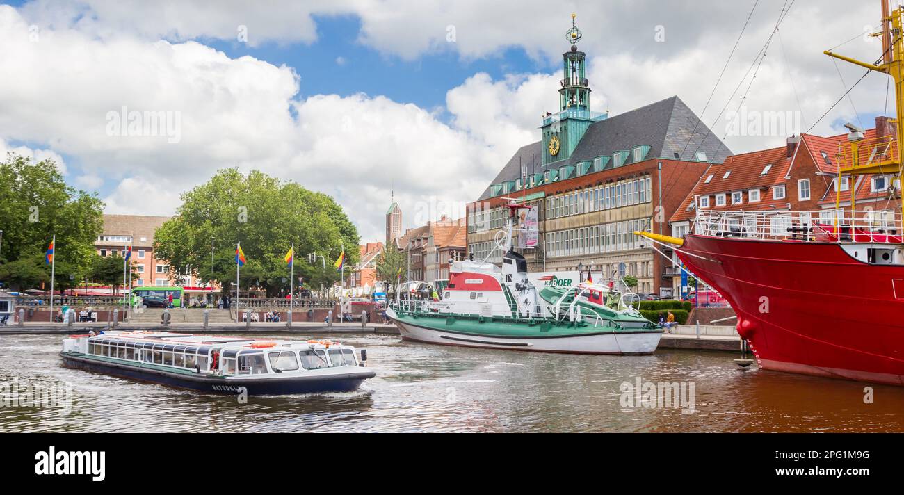 Panorama of a cruiseboat in front of the historic town hall of Emden ...