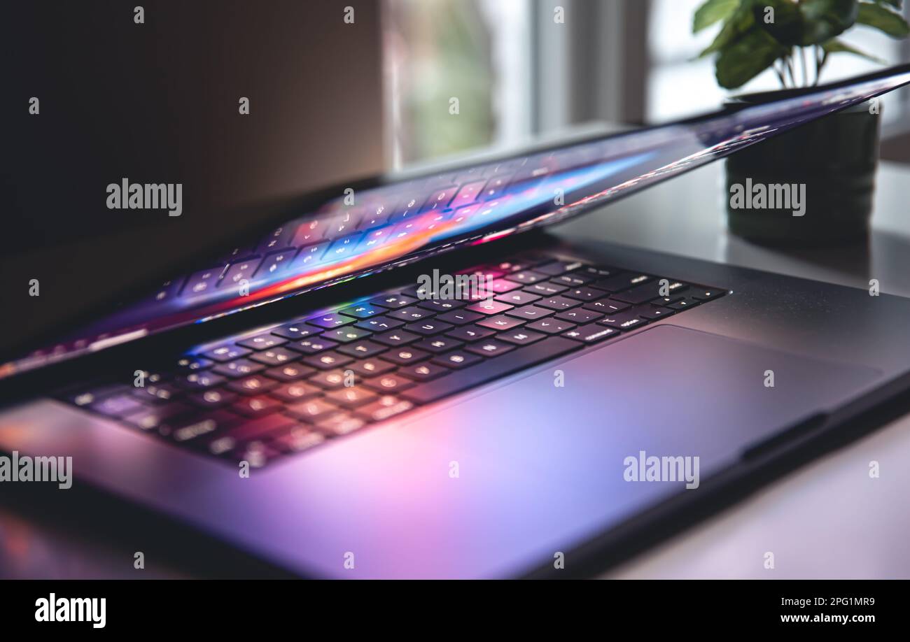 Close up of laptop keyboard colorful neon illumination, backlit ...