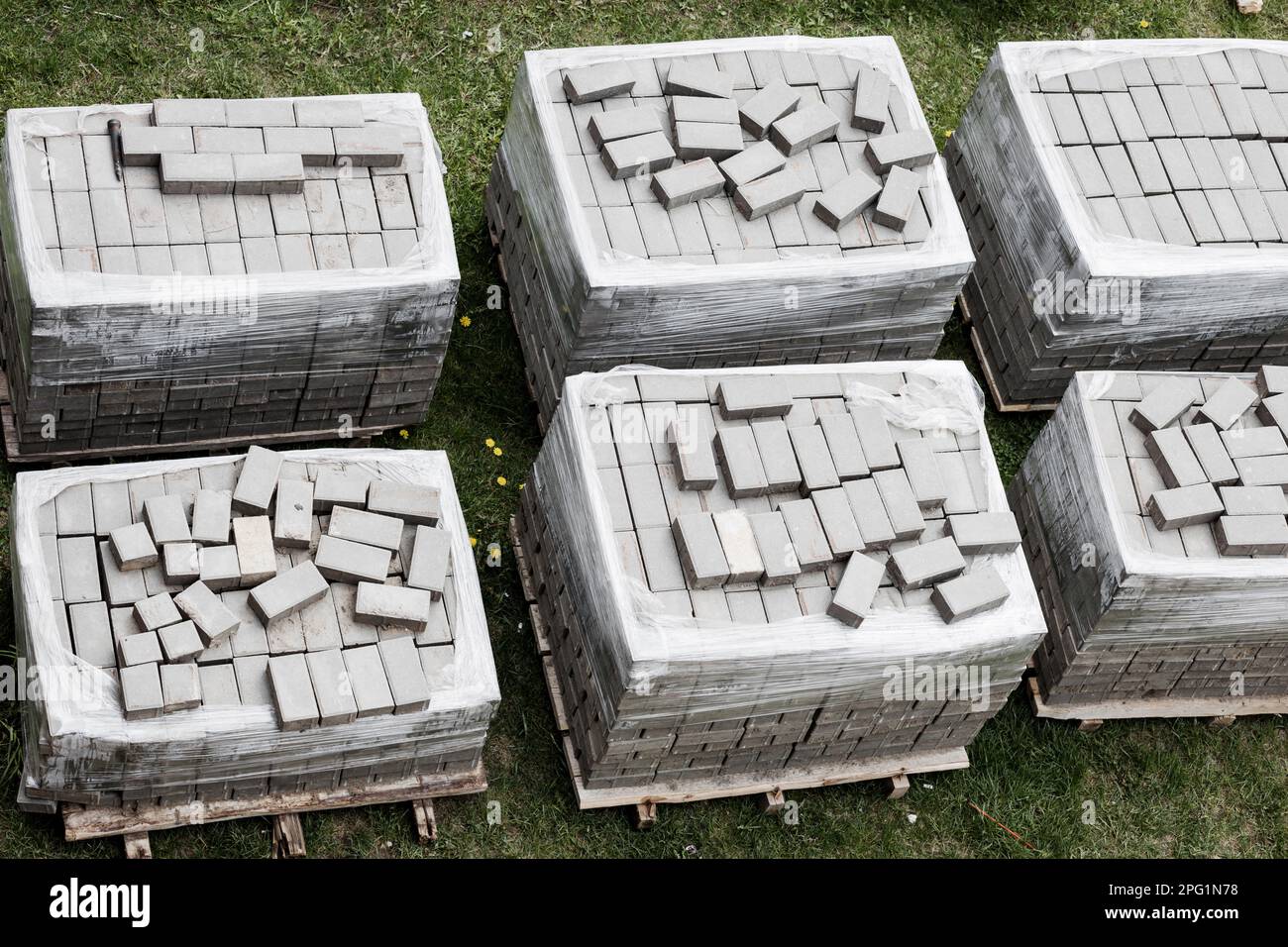 Paving slabs, tiles piled in pallets. Paving slabs at construction site ...