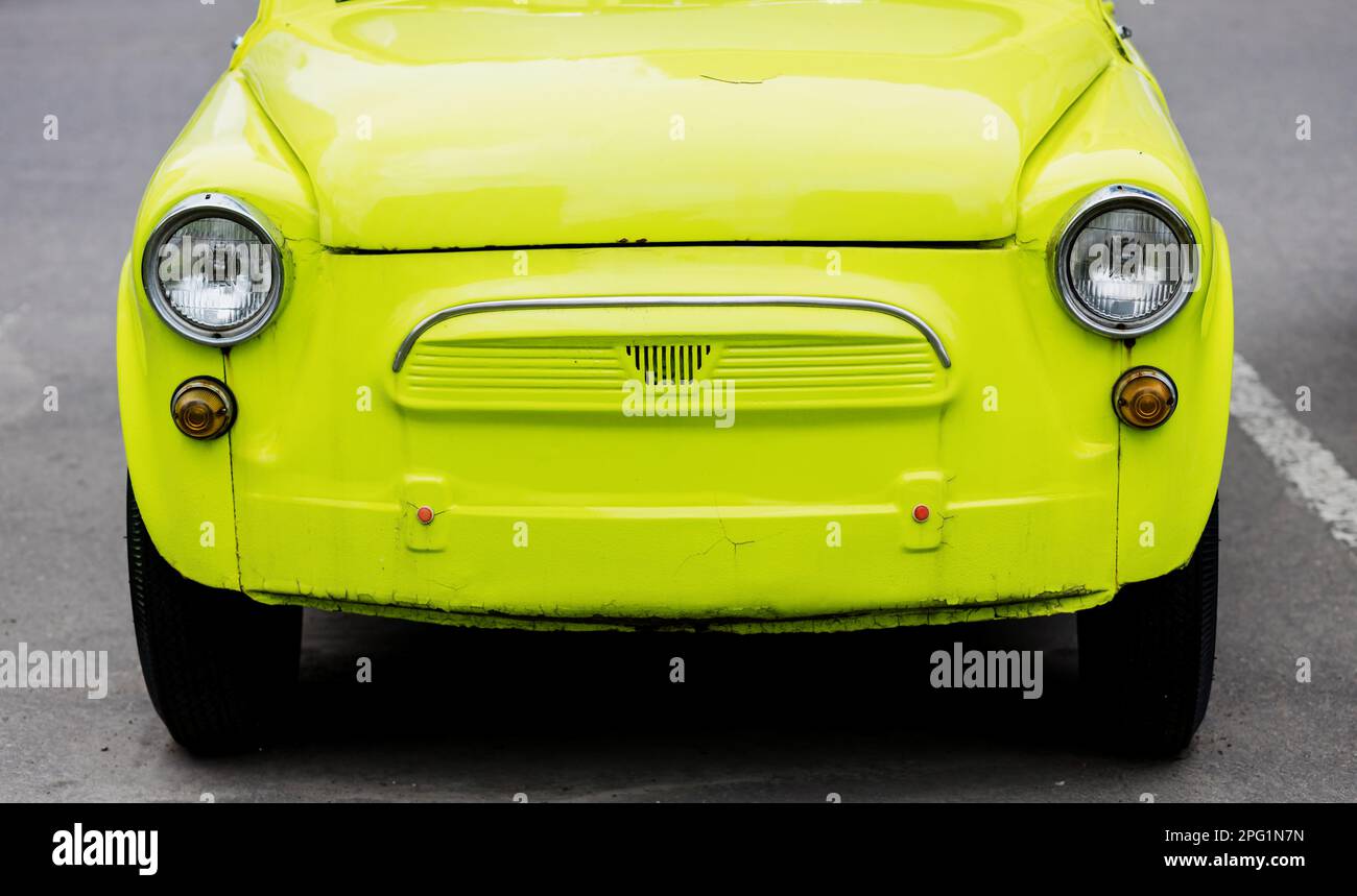 Yellow retro car. classic vehicle. vintage automobile Stock Photo - Alamy