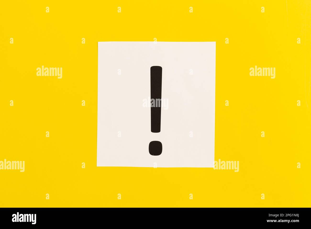 Exclamation mark on white paper on yellow background, flat lay Stock ...