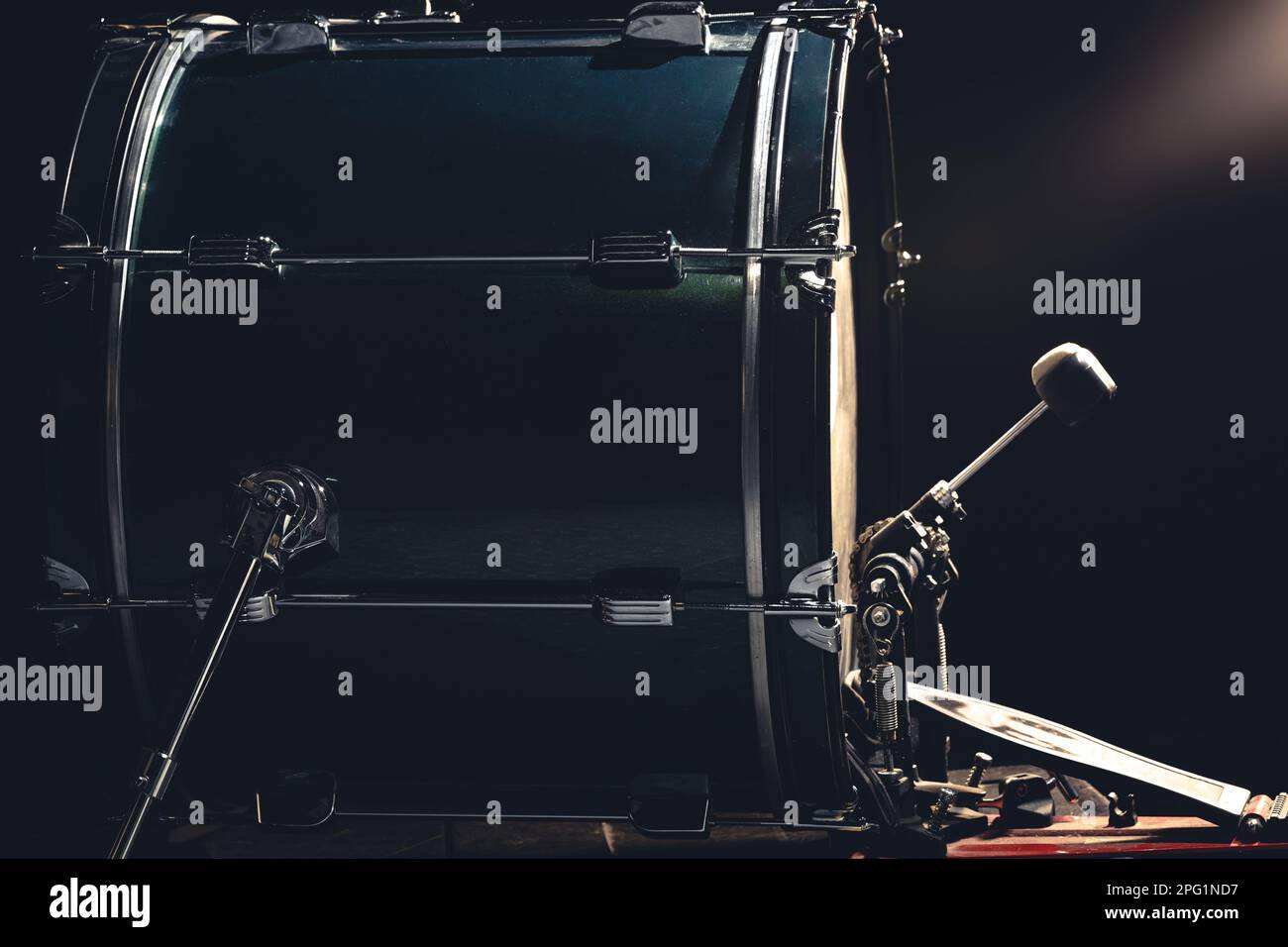 Bass drum with pedal, musical instrument on black background Stock ...