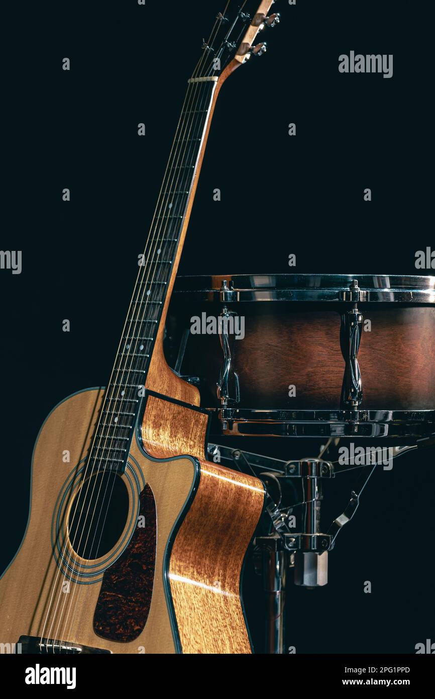 Acoustic guitar and snare drum on a black background isolated Stock ...
