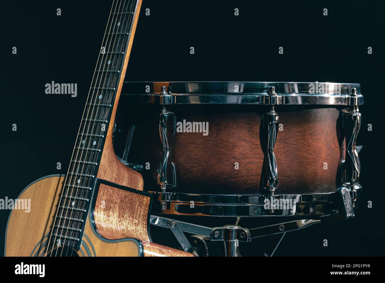 Acoustic guitar and snare drum on a black background isolated Stock ...