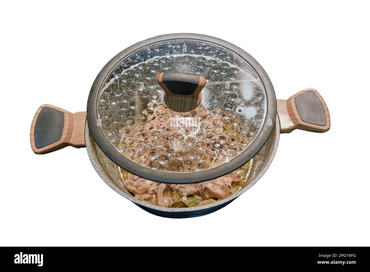 The pot is placed on an electric kitchen stove with the lid open ...
