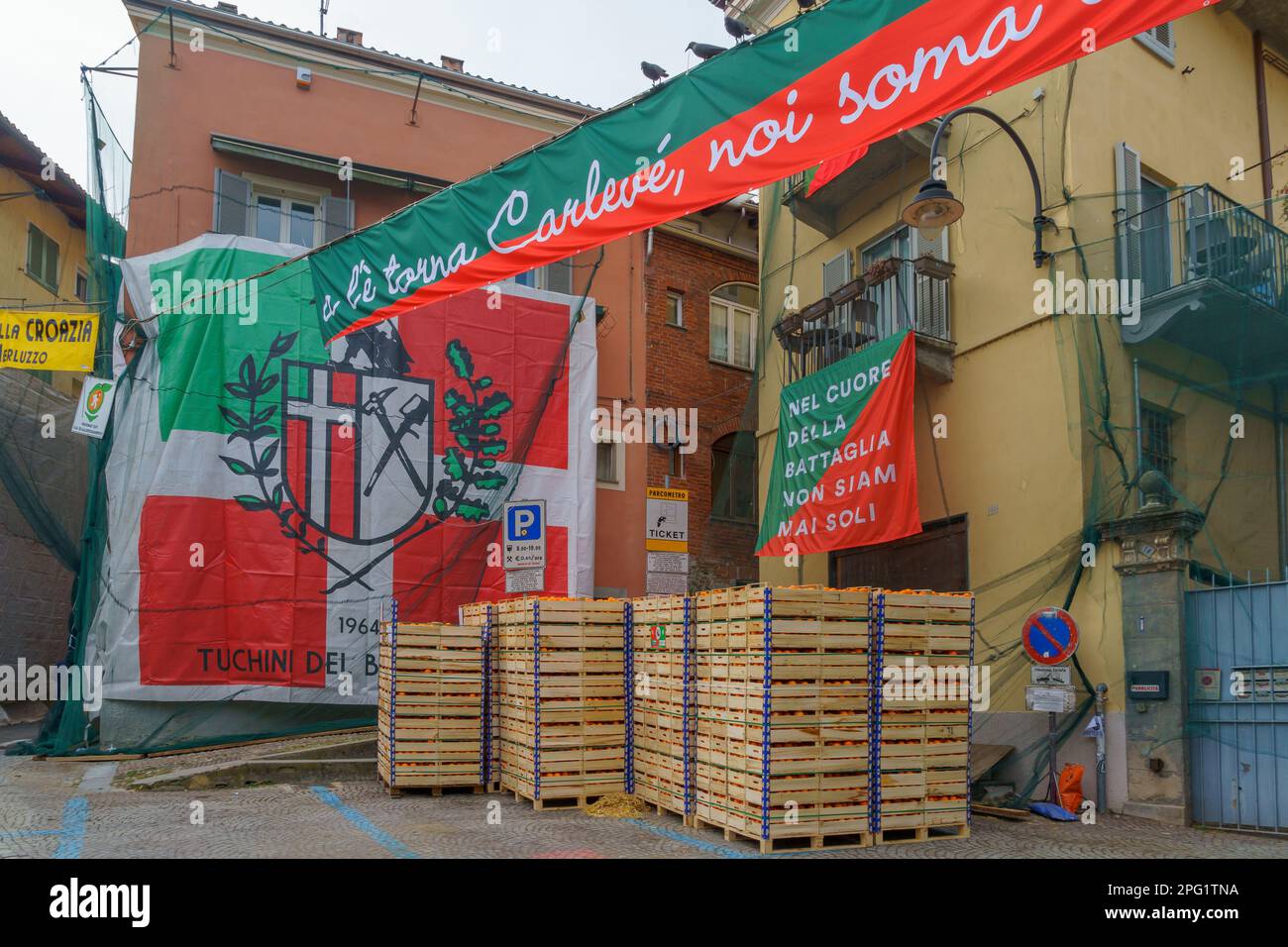 Ivrea, Italy - February 19, 2023: Oranges boxes and protection nets ...