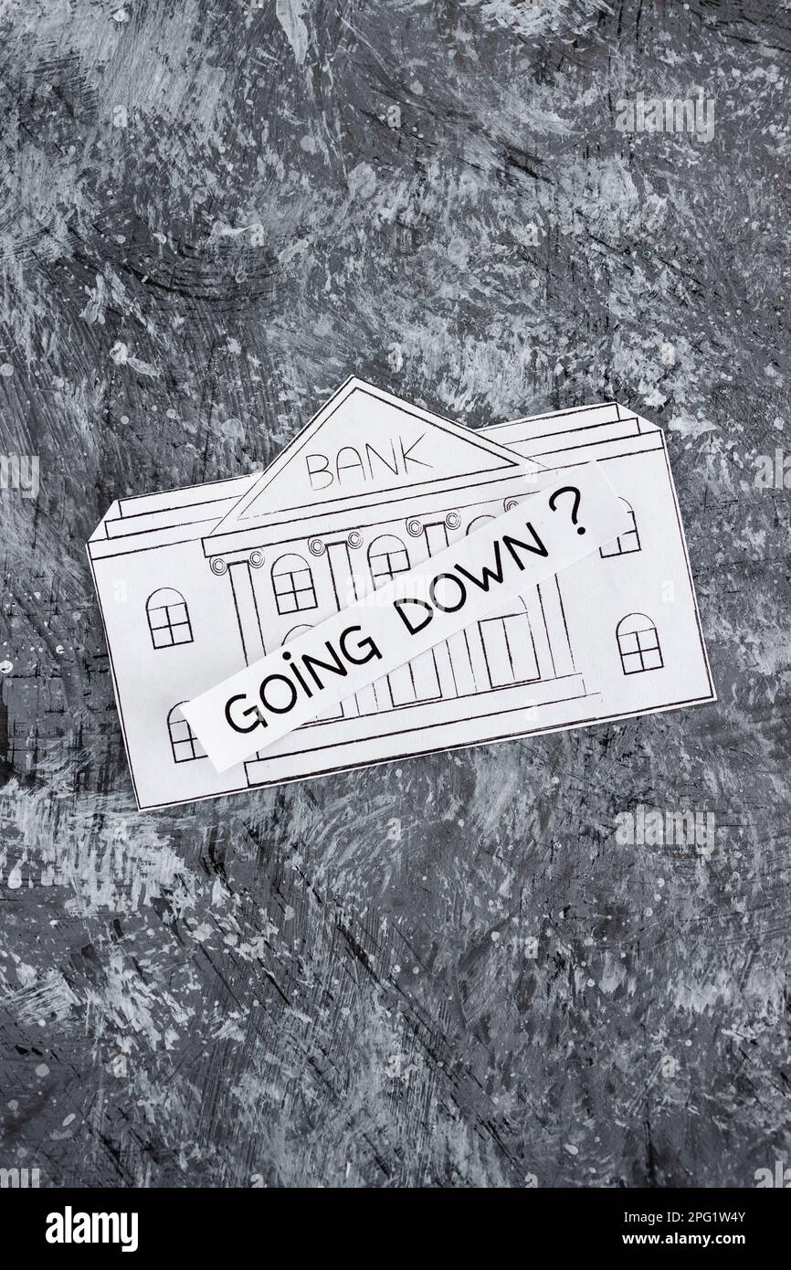 bank made of paper with Going Down ? caption above it, concept of ...