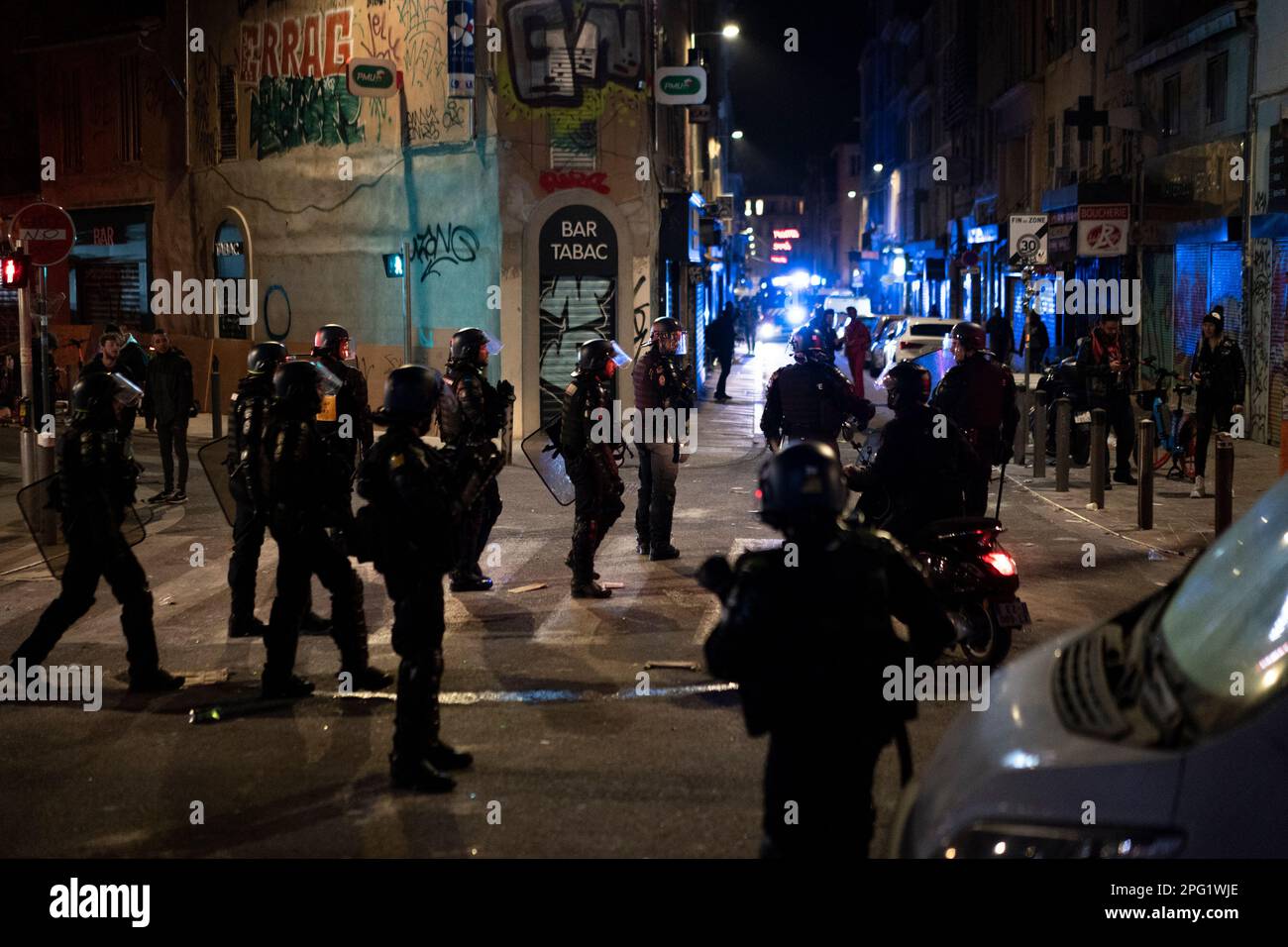 A carnival goer is arrested by riot police during Marseille's Carnaval ...