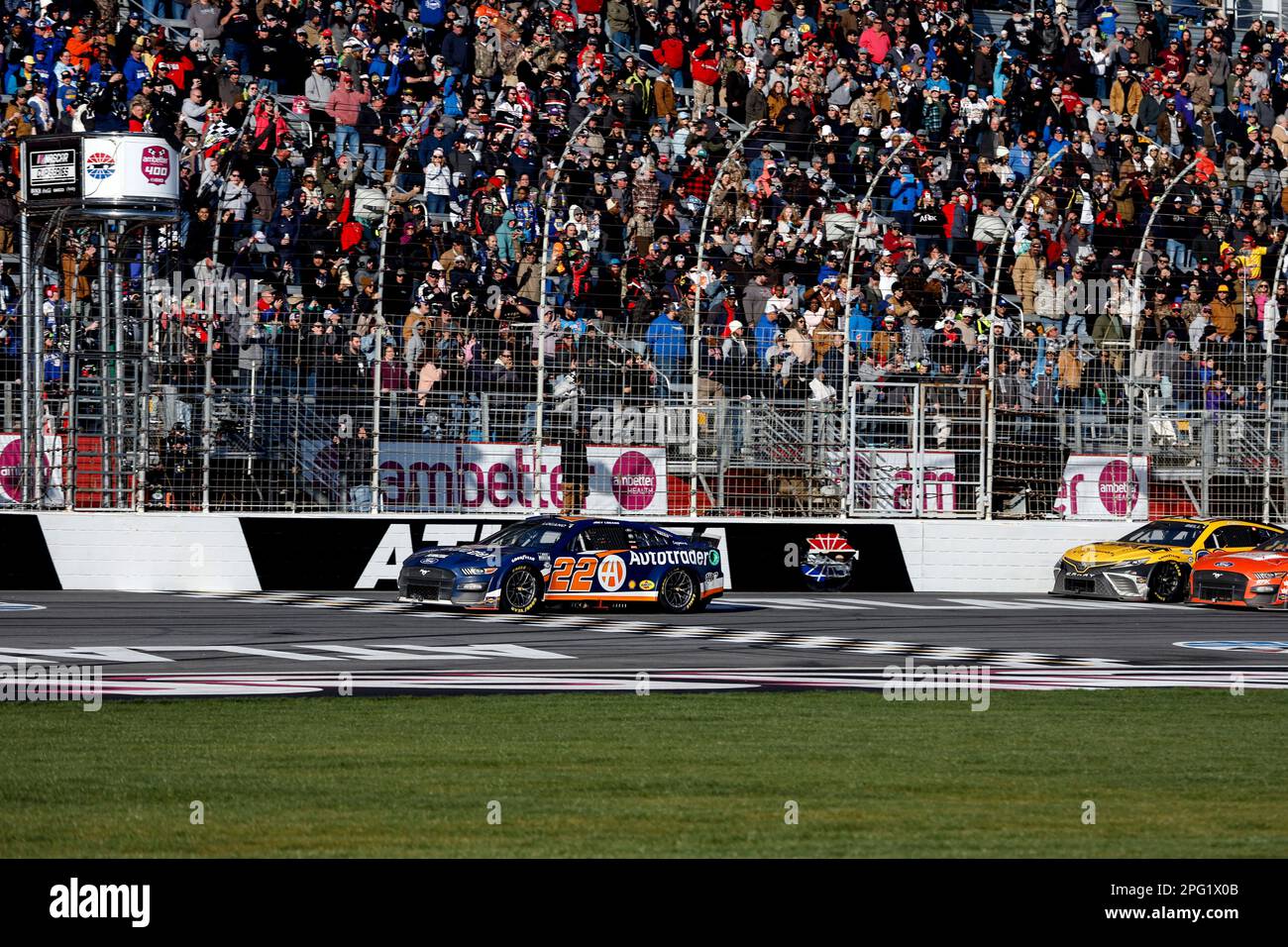 Joey Logano (22) takes the checkered flag to win the NASCAR Cup Series ...