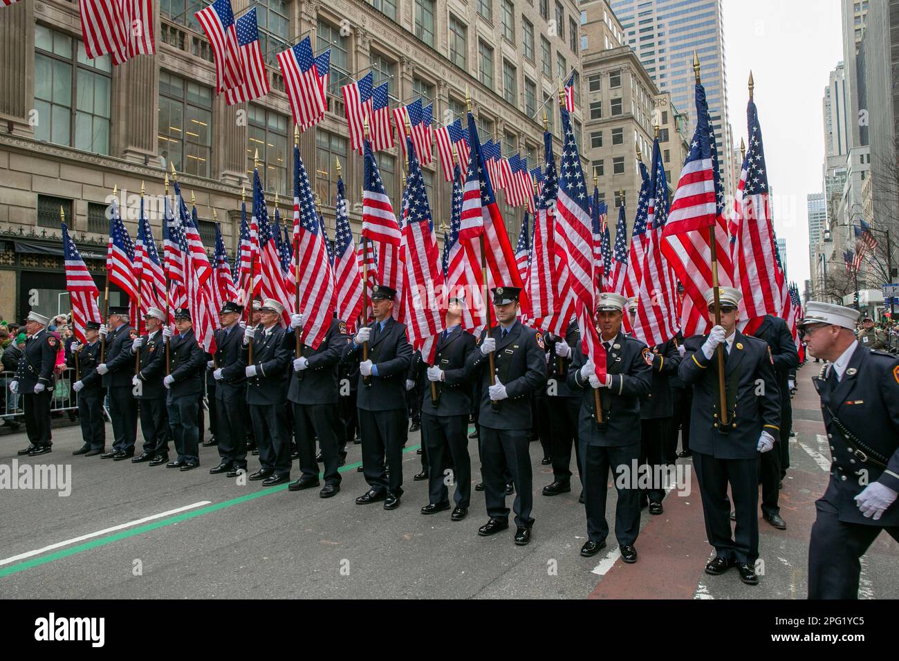 Members of the New York City Fire Department carry American flags in ...