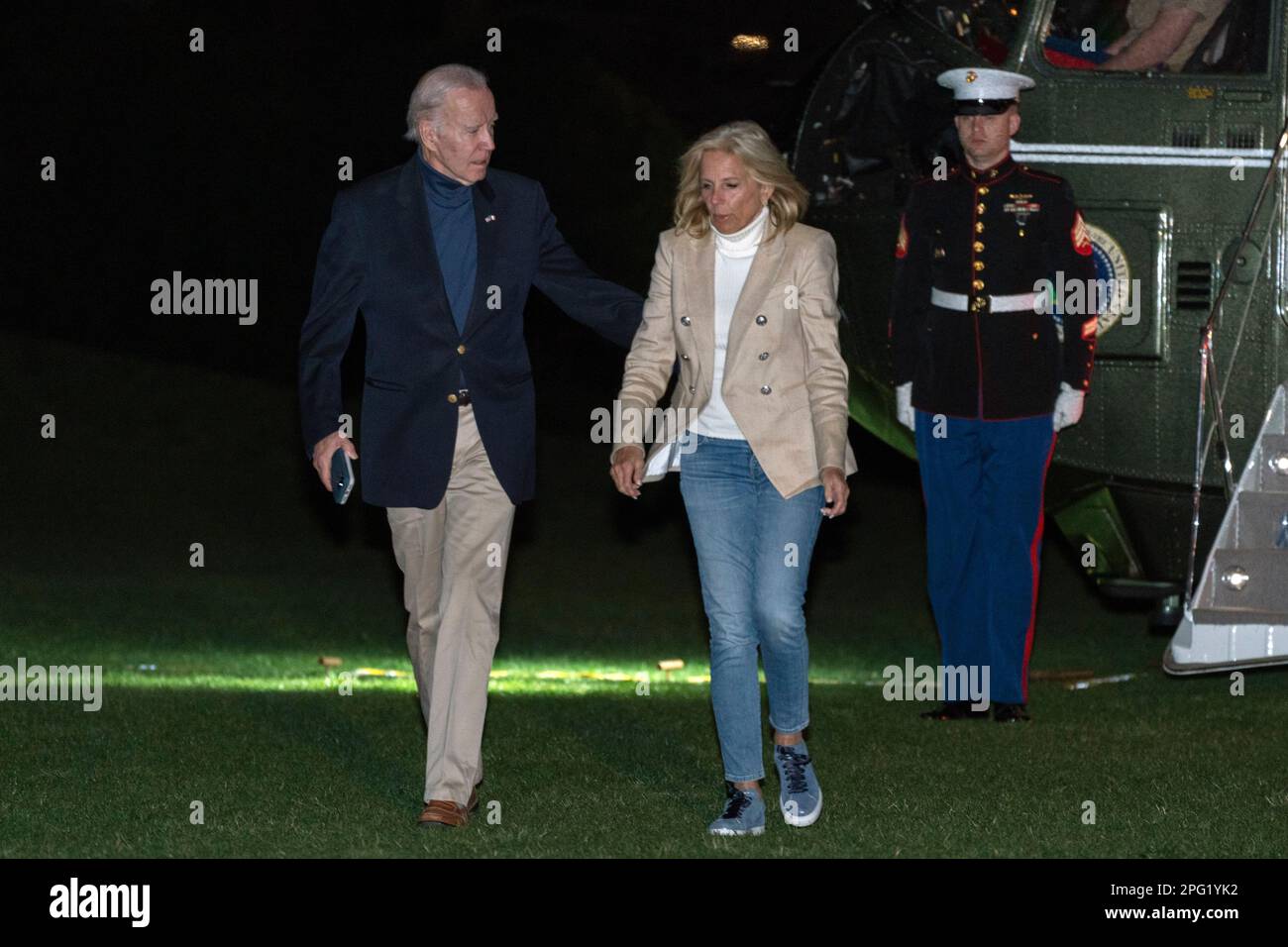 President Joe Biden and first lady Jill Biden walk on the South Lawn as ...