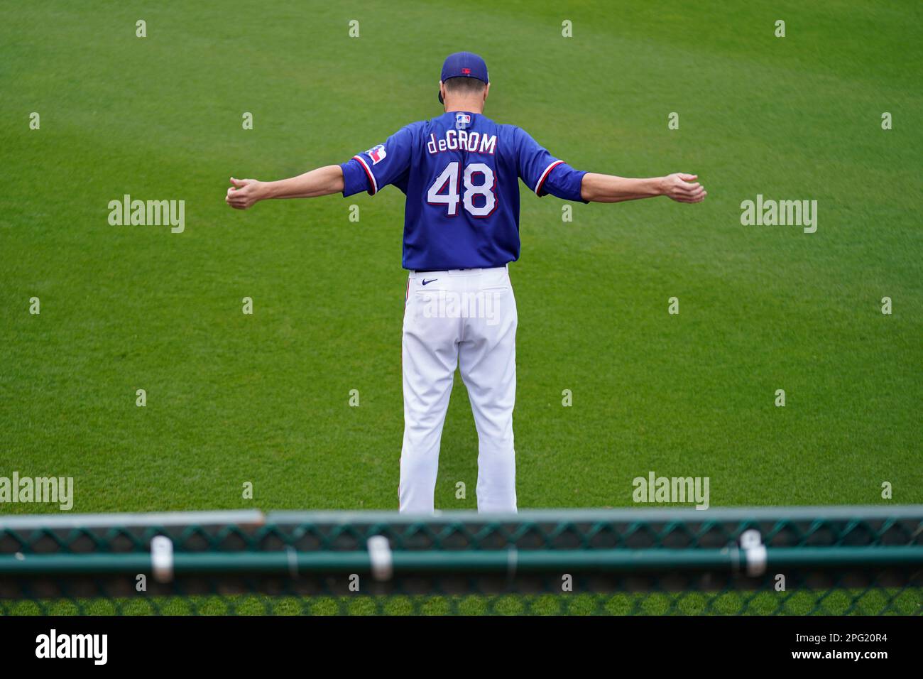 Texas Rangers starting pitcher Jacob deGrom warms up before a spring ...
