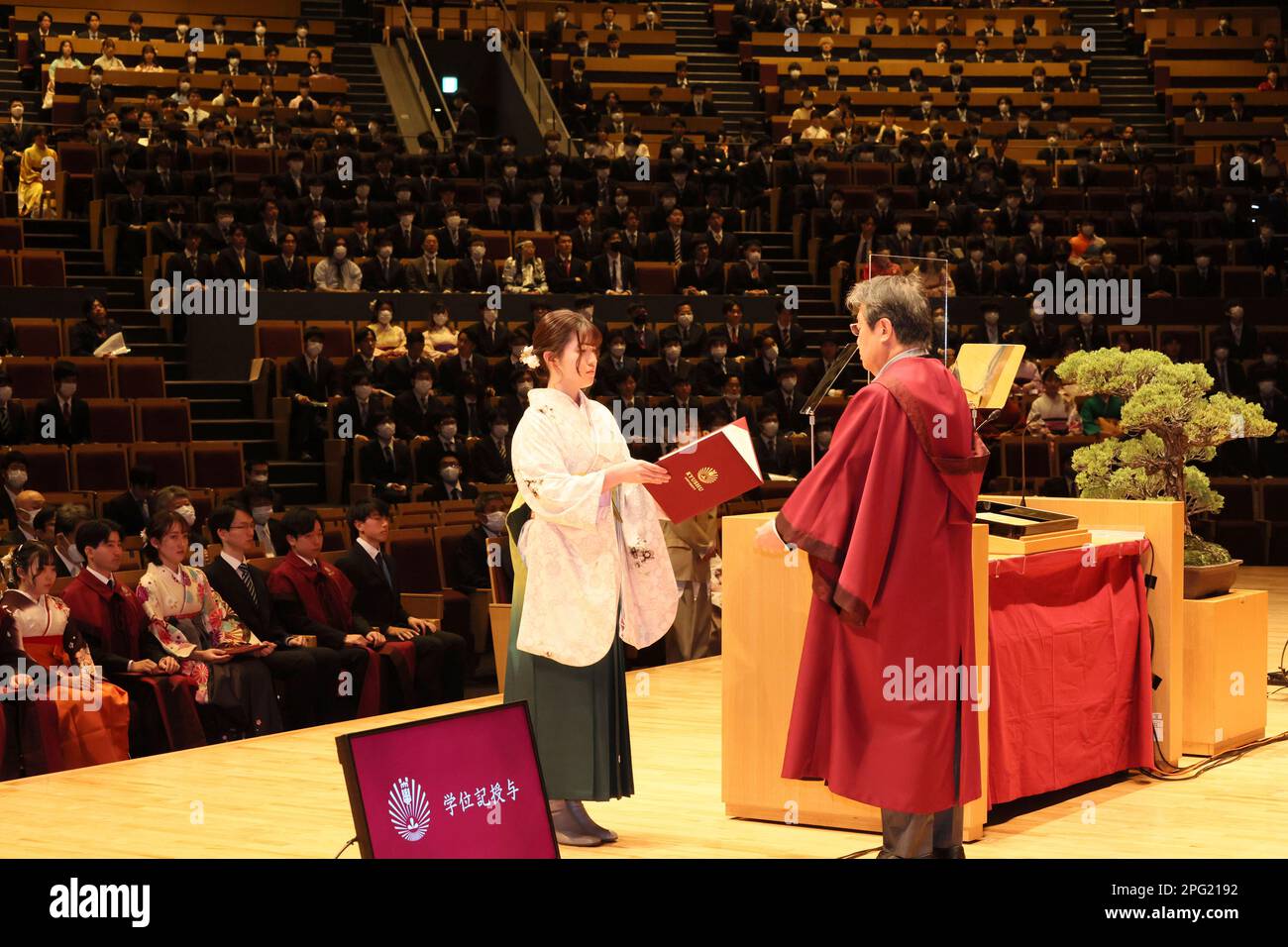 Students attend the graduation ceremony at Kyushu University Ito Campus ...