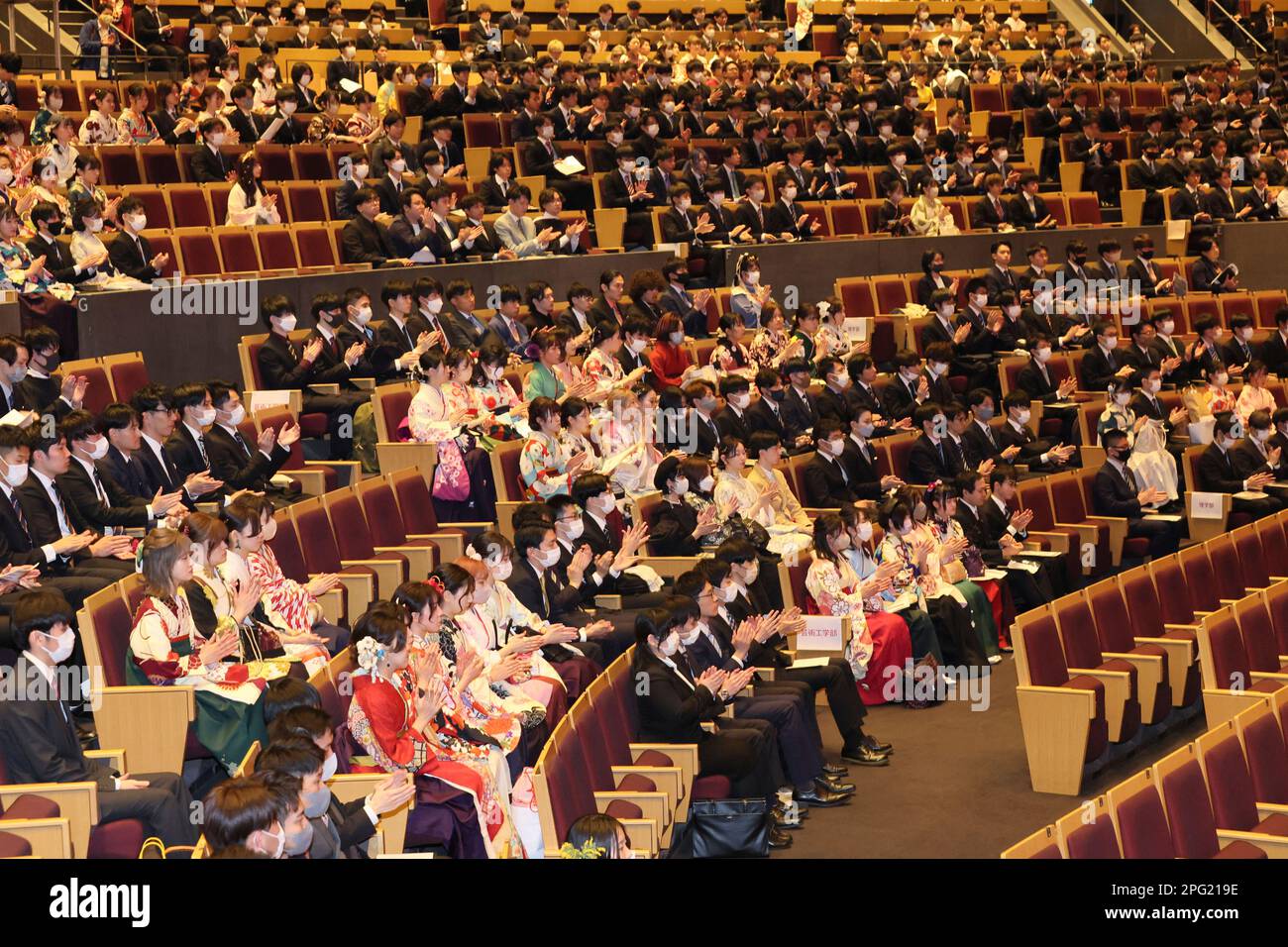 Students attend the graduation ceremony at Kyushu University Ito Campus ...