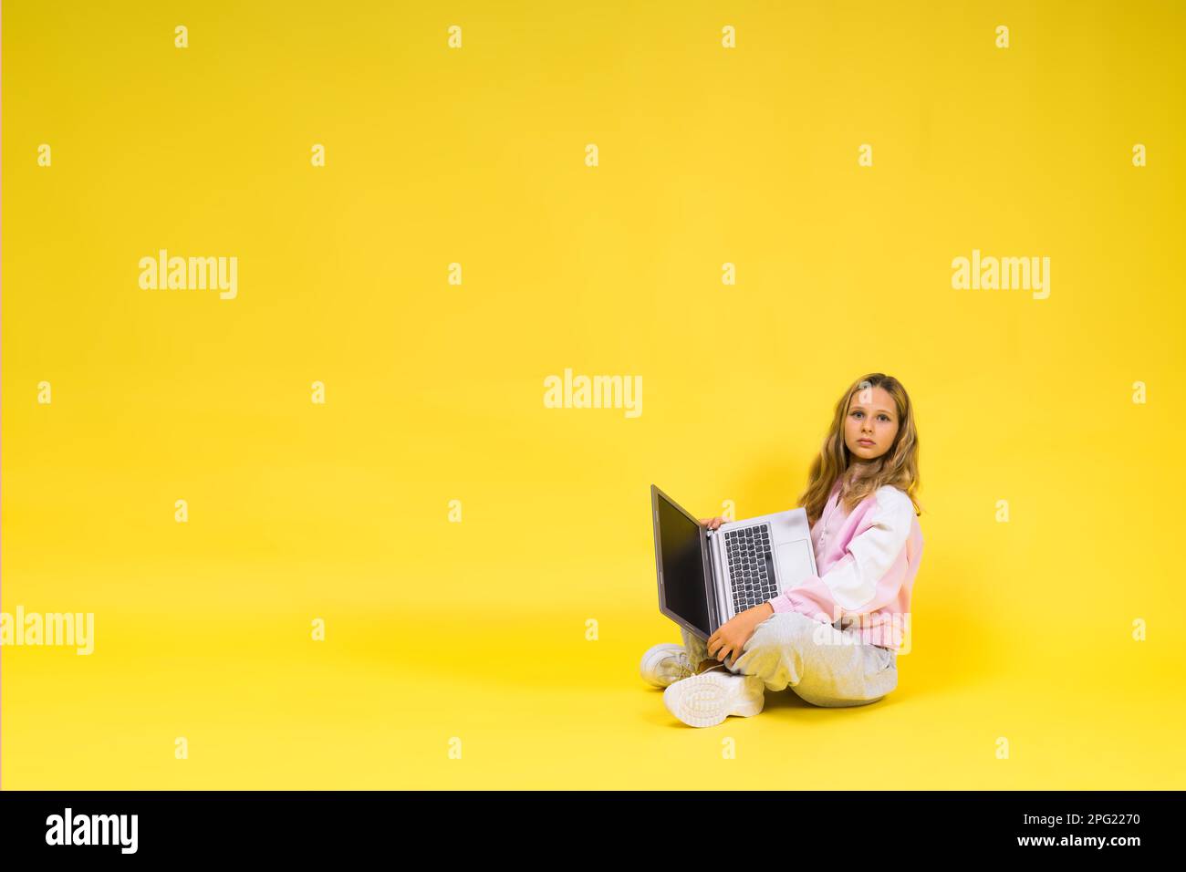 Positive kid sit with a laptop read homework wear casual style cloth ...