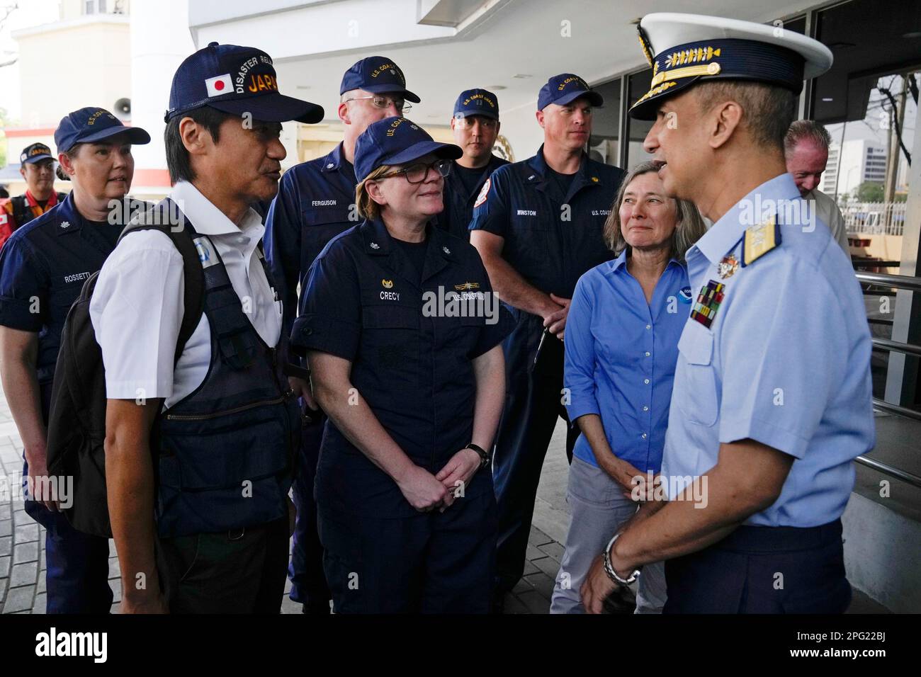 Philippine Coast Guard spokesperson Rear Admiral Armando Balilo, right ...